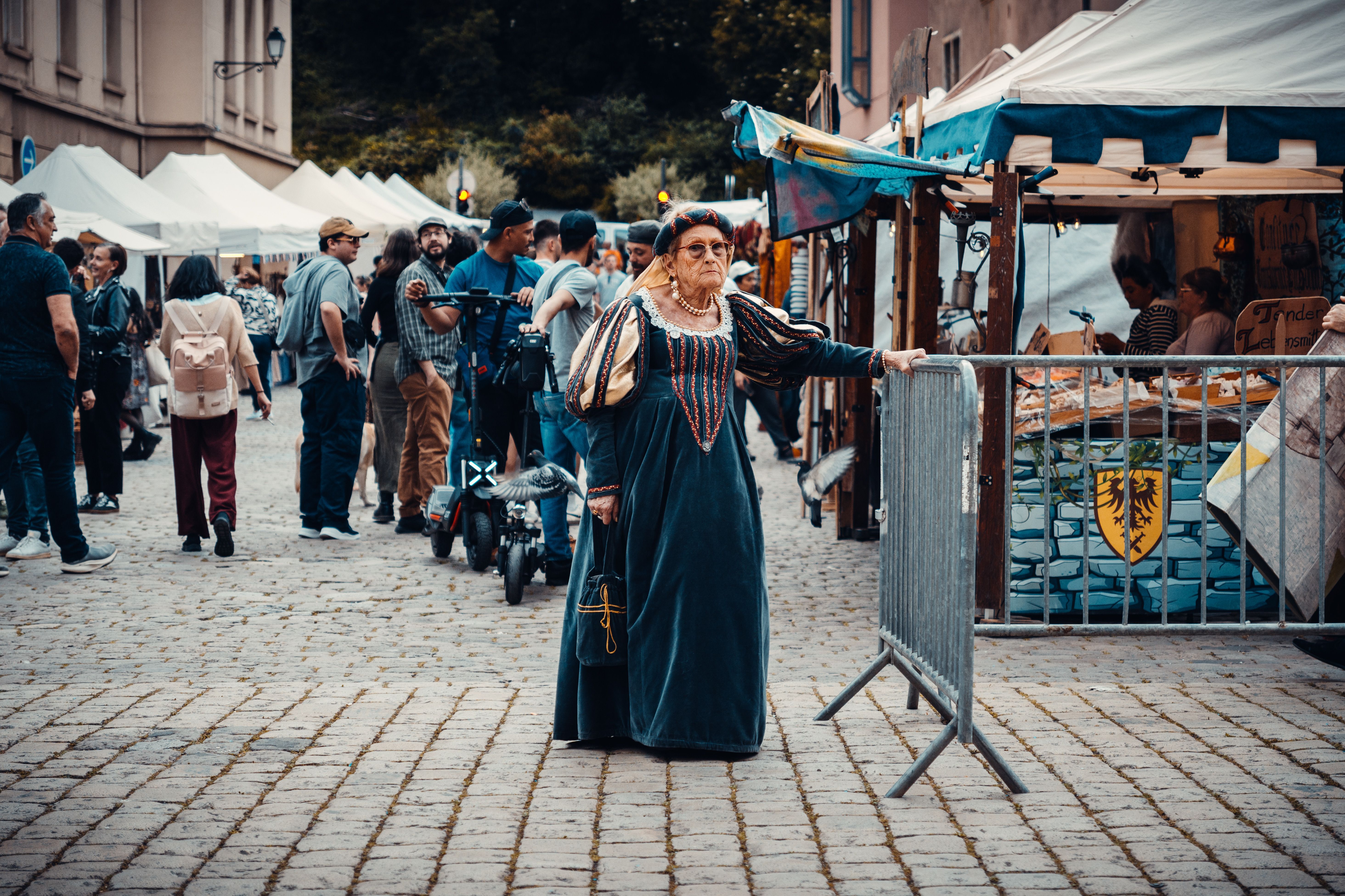 Renaissance Fair Crowd with Woman in Period Dress · Free Stock Photo
