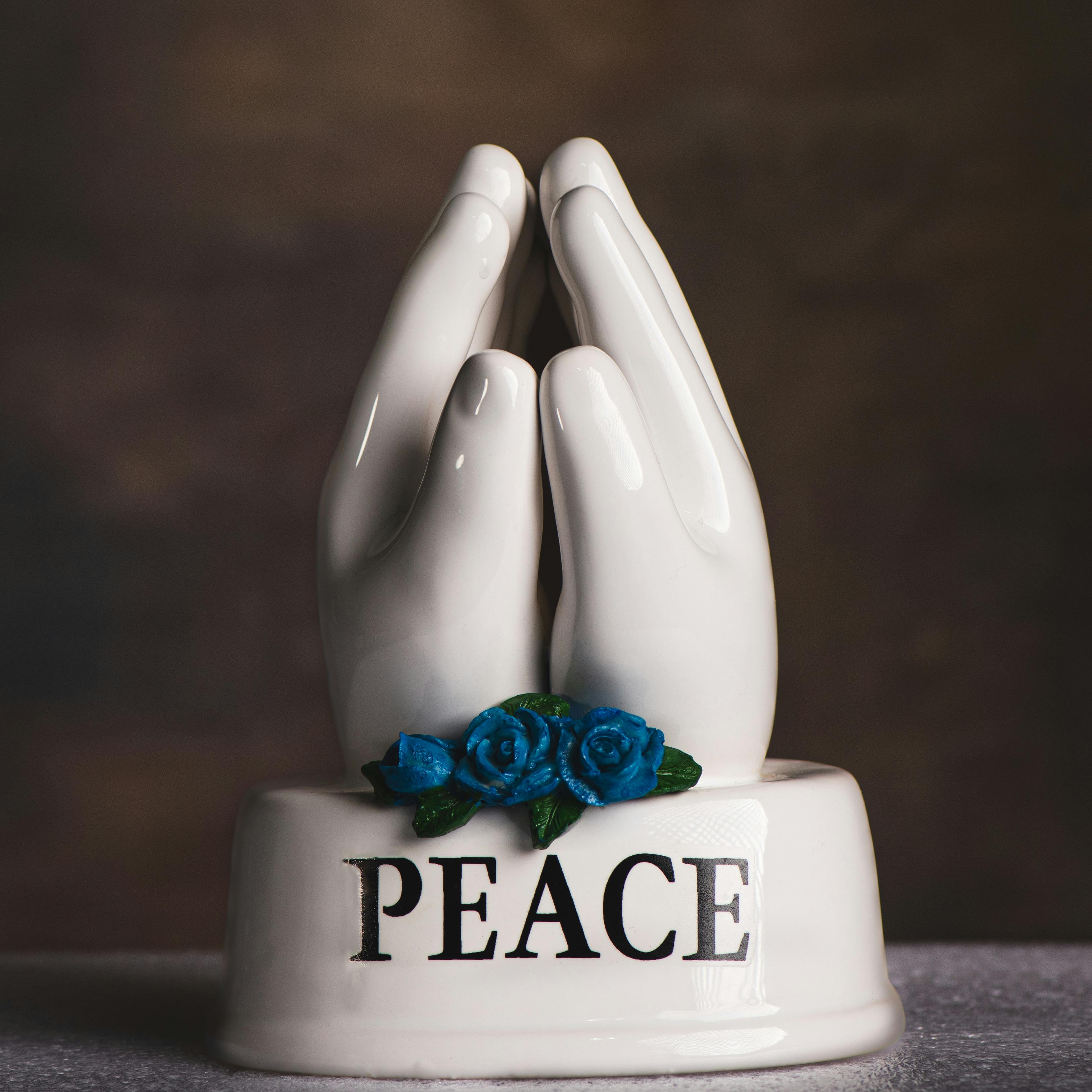 Ceramic Hands Sculpture with Symbolic Peace Message · Free Stock Photo