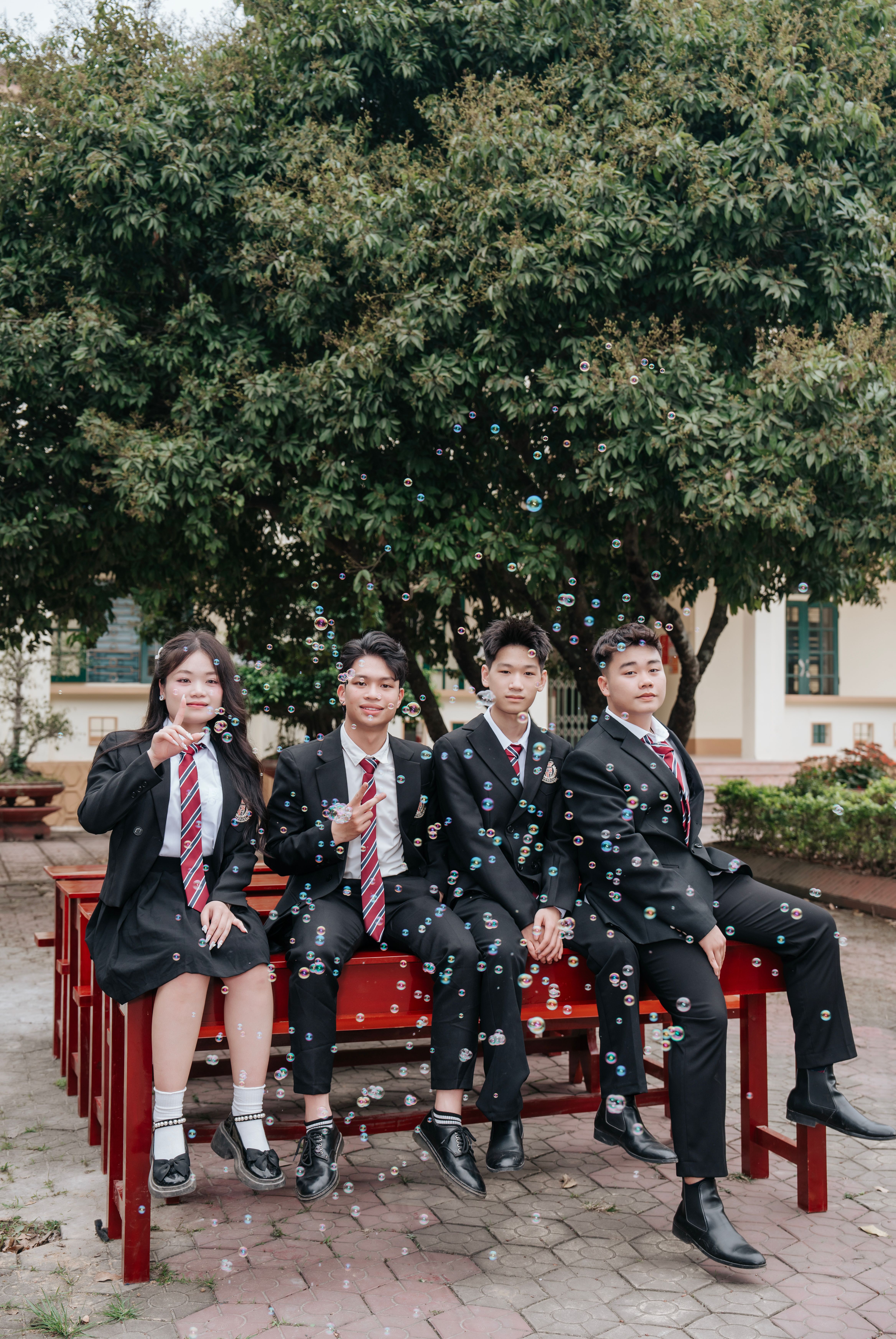 Group of Young Men in Formal Attire Outdoors · Free Stock Photo