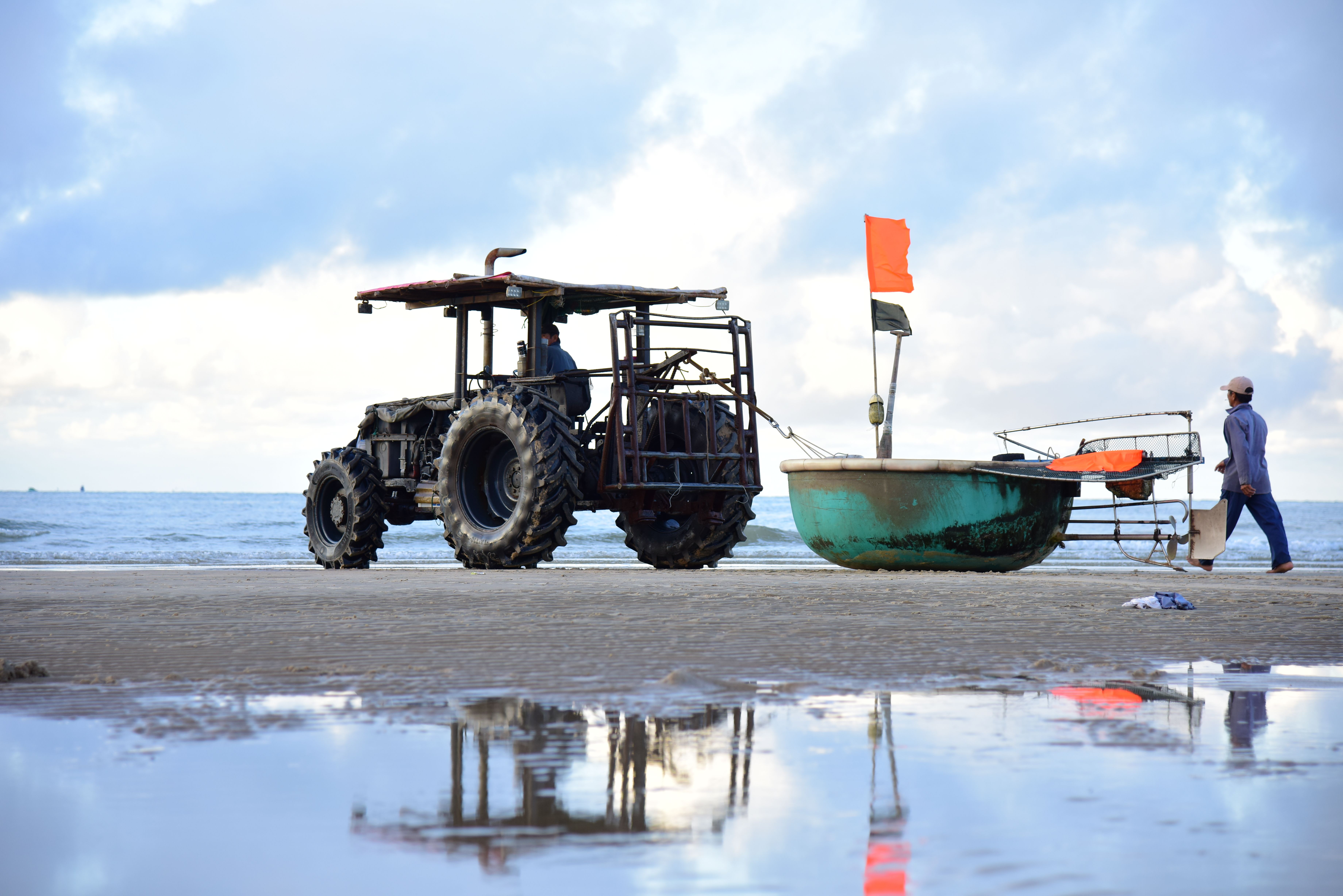 Tractor and Fishing Boat on a Beach at Sunrise · Free Stock Photo
