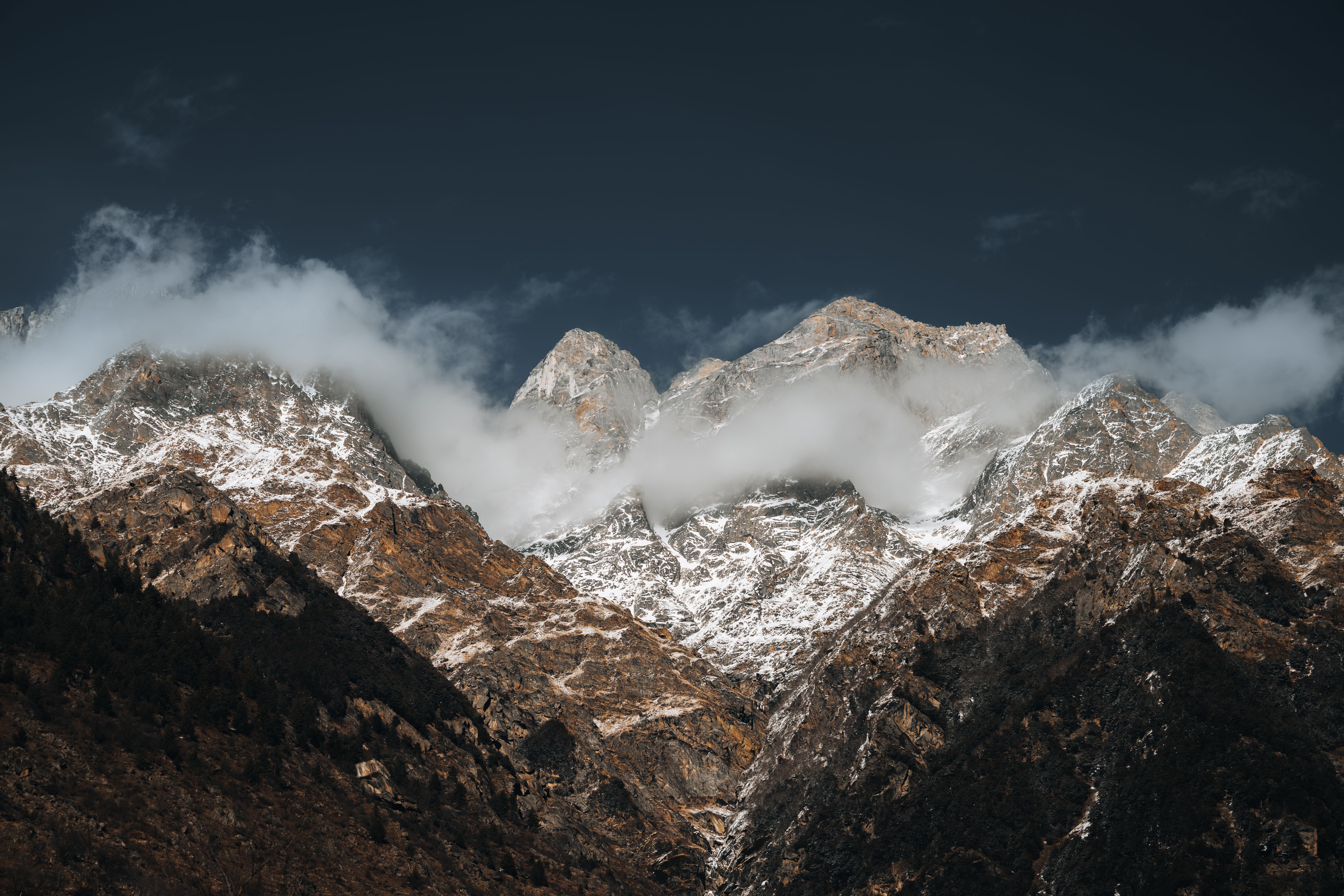 Snow-Capped Himalayan Peaks Under Dramatic Sky · Free Stock Photo