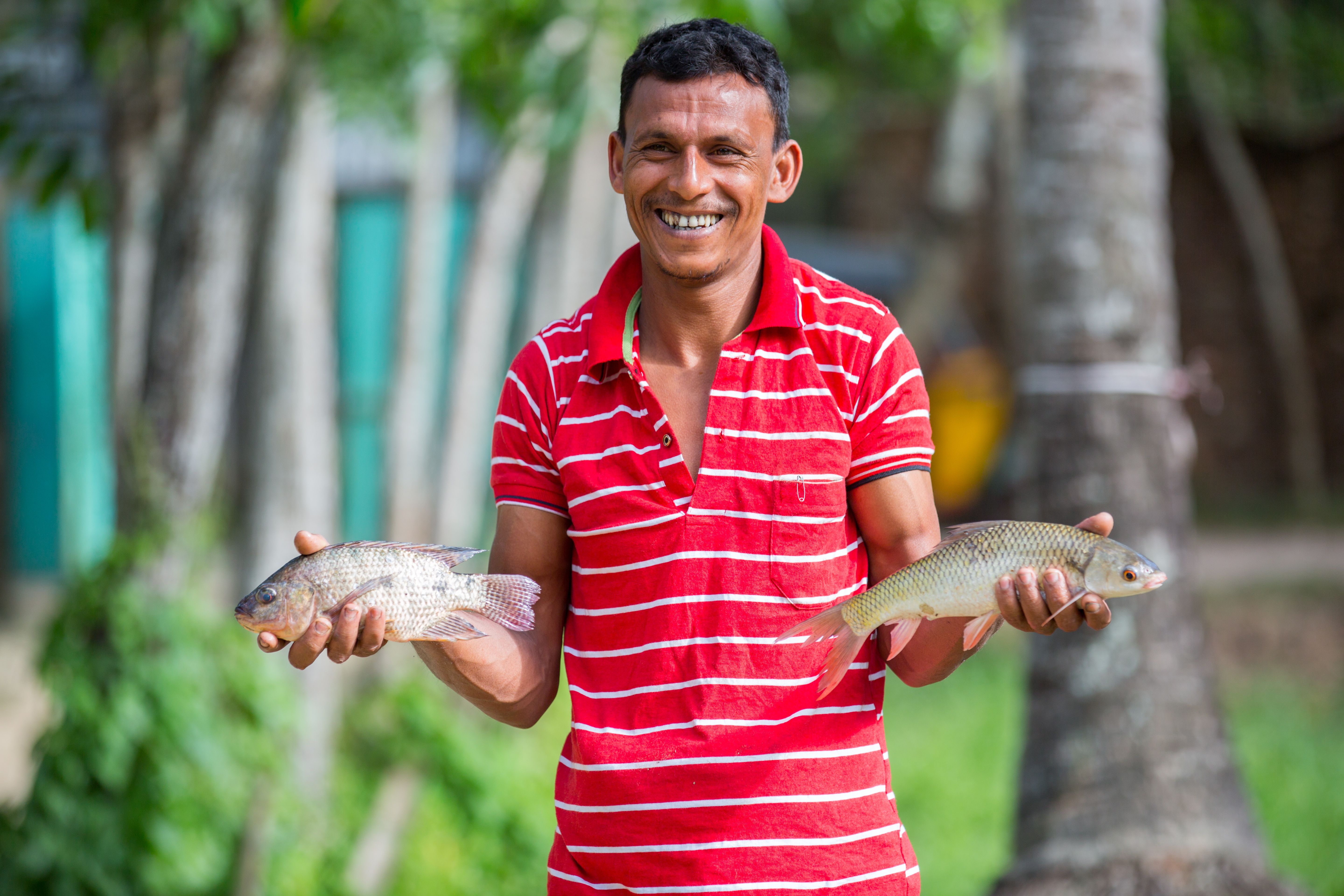 Man Enjoying Fresh Outdoor Fishing Catch · Free Stock Photo
