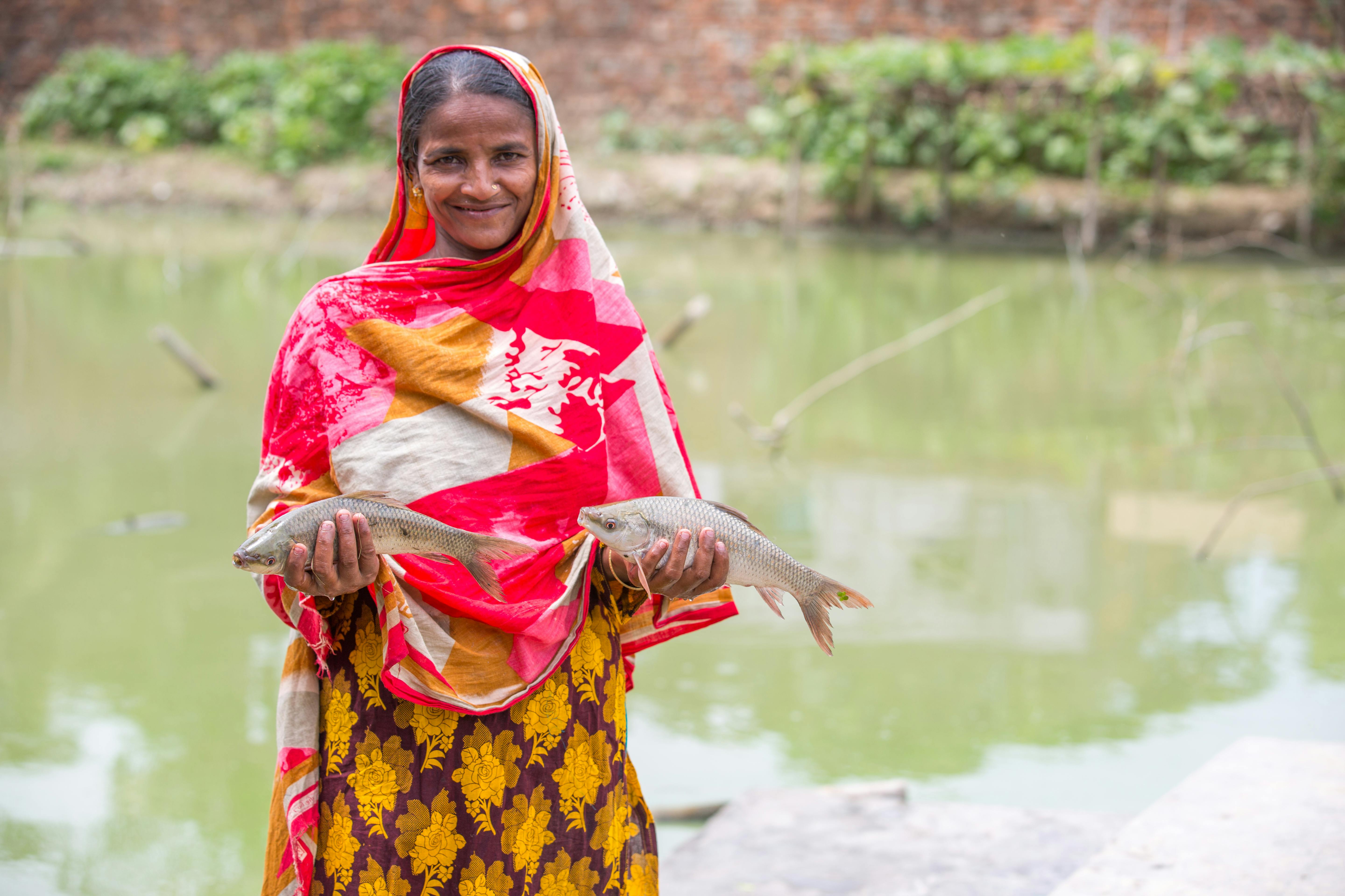 Woman Holding Freshly Caught Fish in Bangladesh · Free Stock Photo