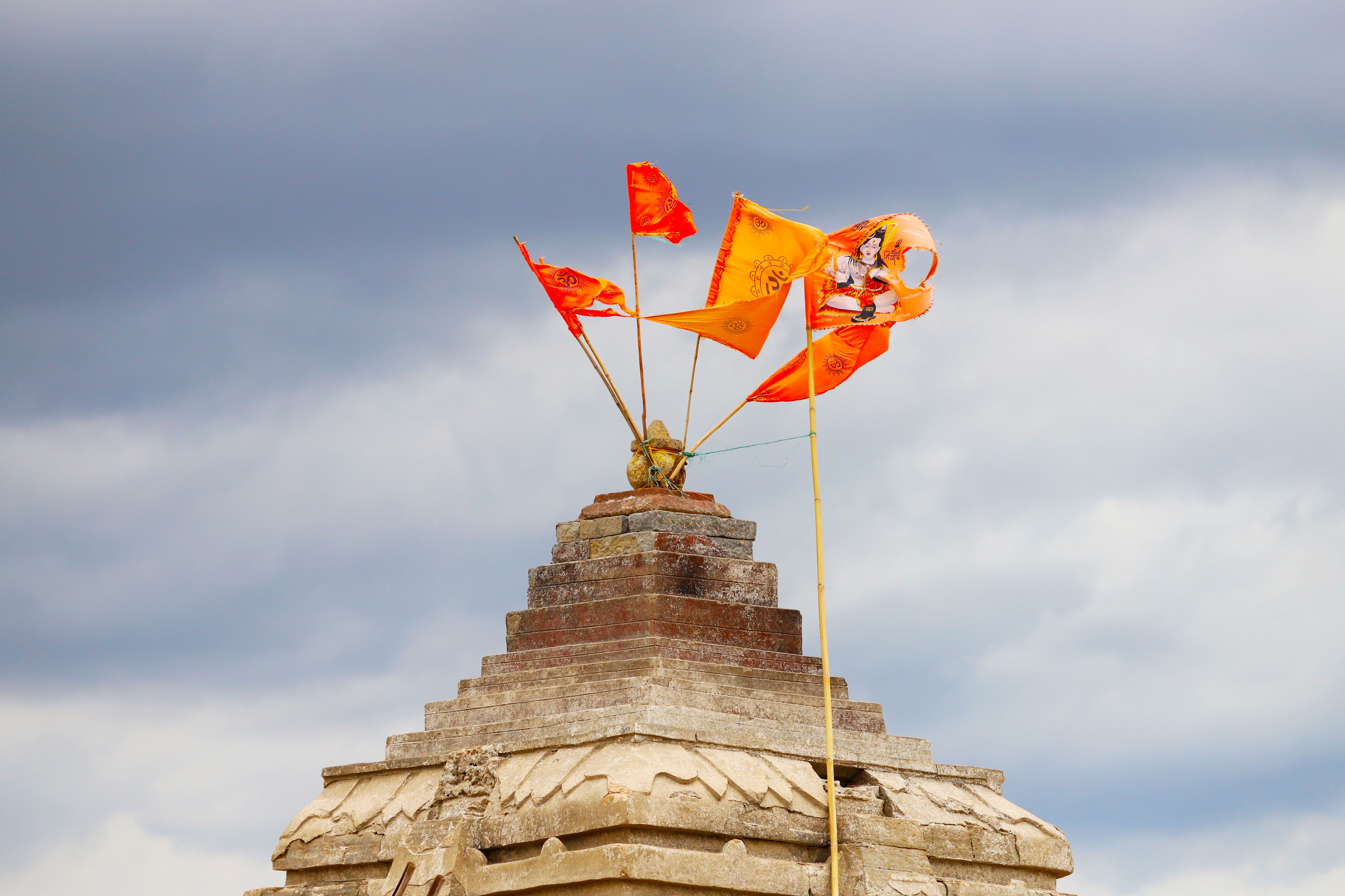 Majestic Temple Flags Against Cloudy Sky · Free Stock Photo