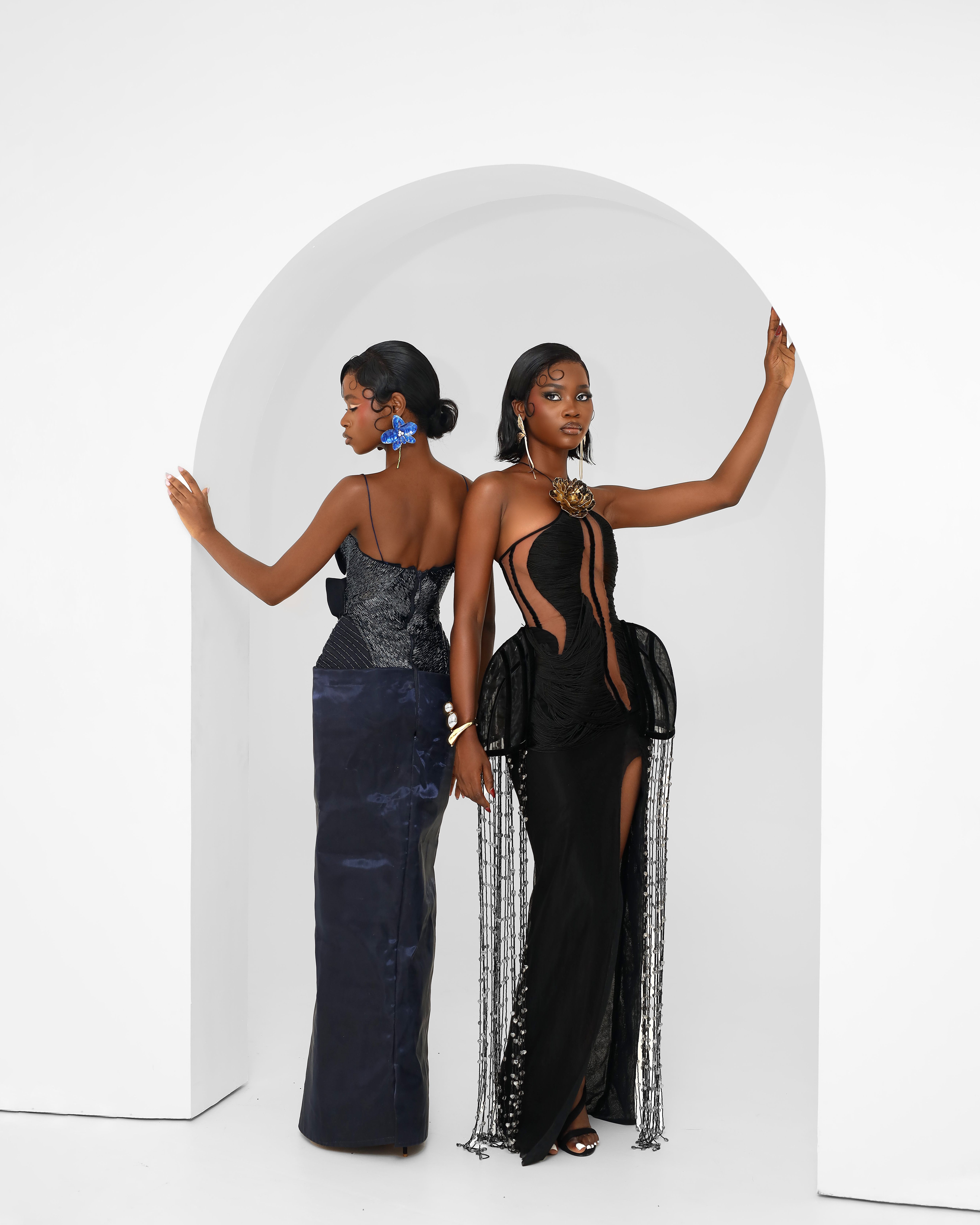 Elegant Fashion Portrait of Two Women in Black Gowns · Free Stock Photo