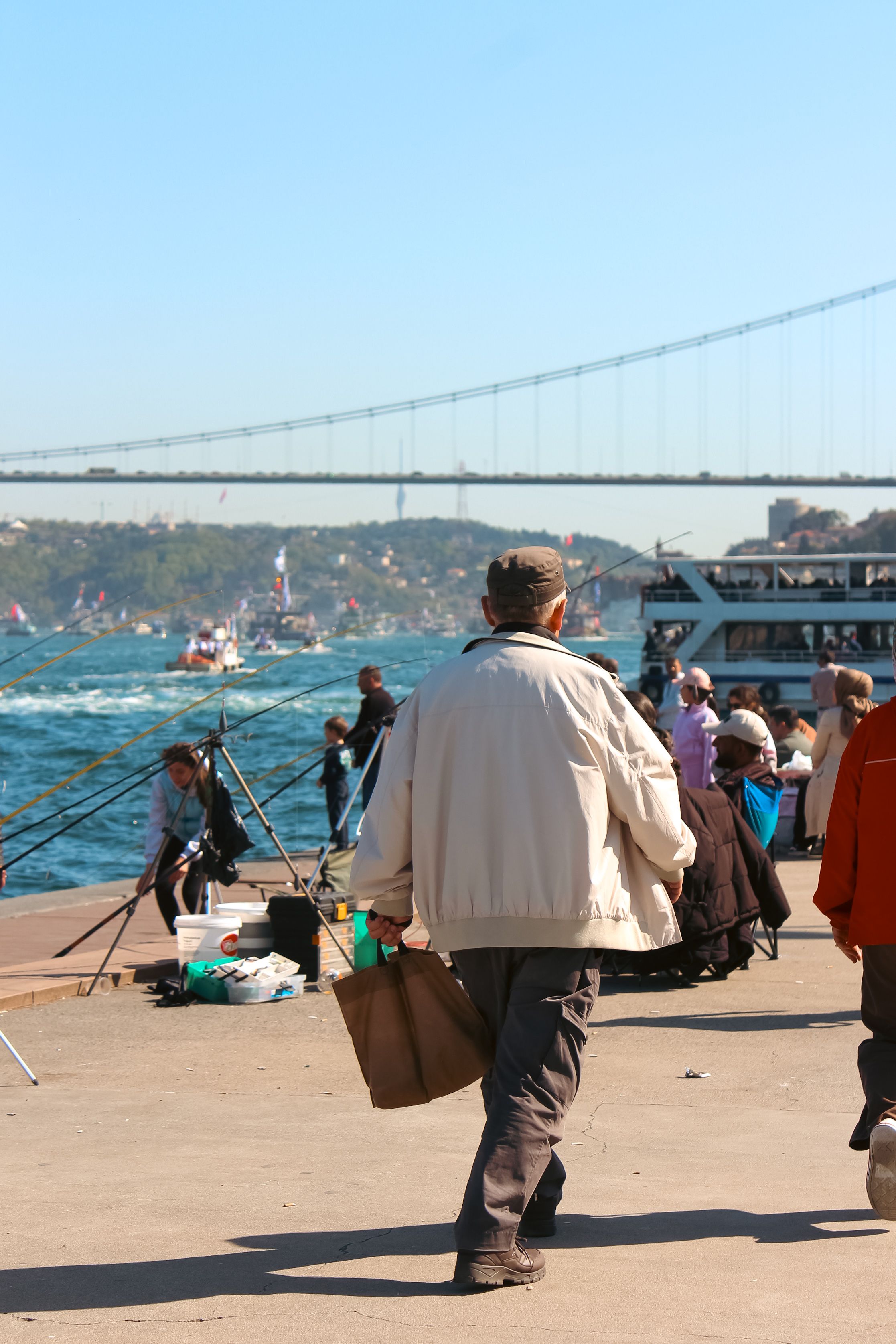 Seaside Promenade near a Famous Suspension Bridge · Free Stock Photo