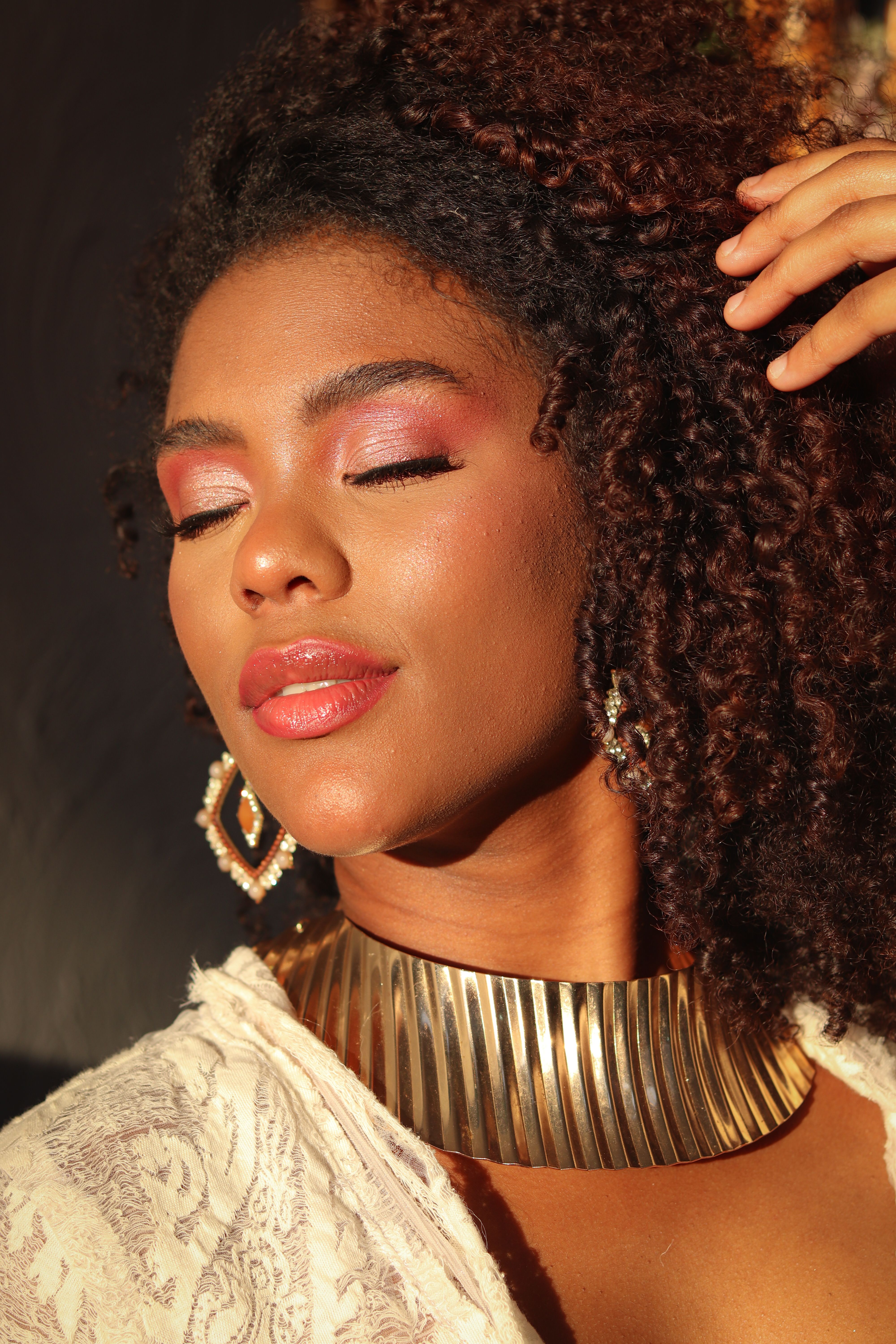 Close-up Portrait of a Woman with Curly Hair · Free Stock Photo