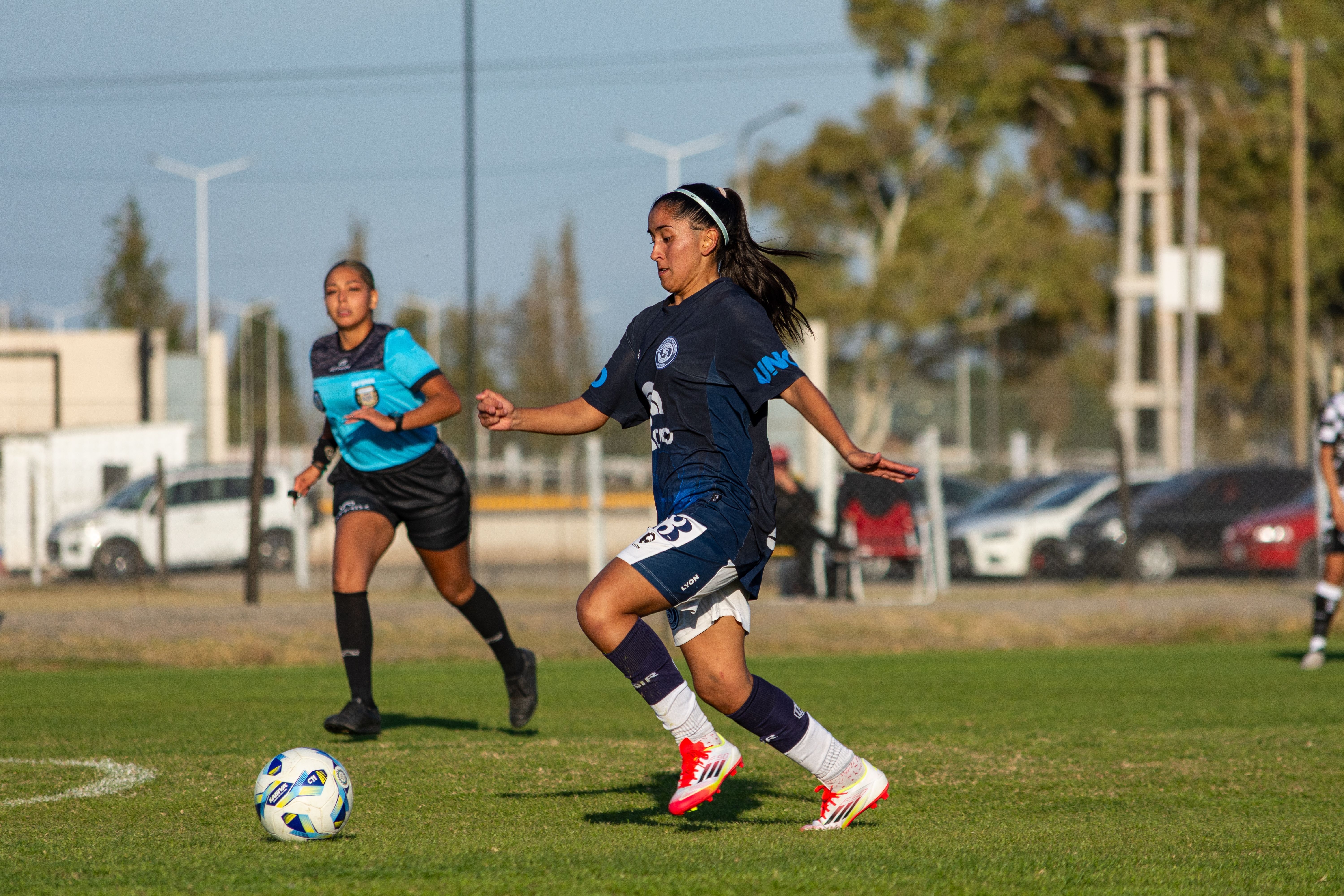 Female Soccer Players in Competitive Match Outdoors · Free Stock Photo