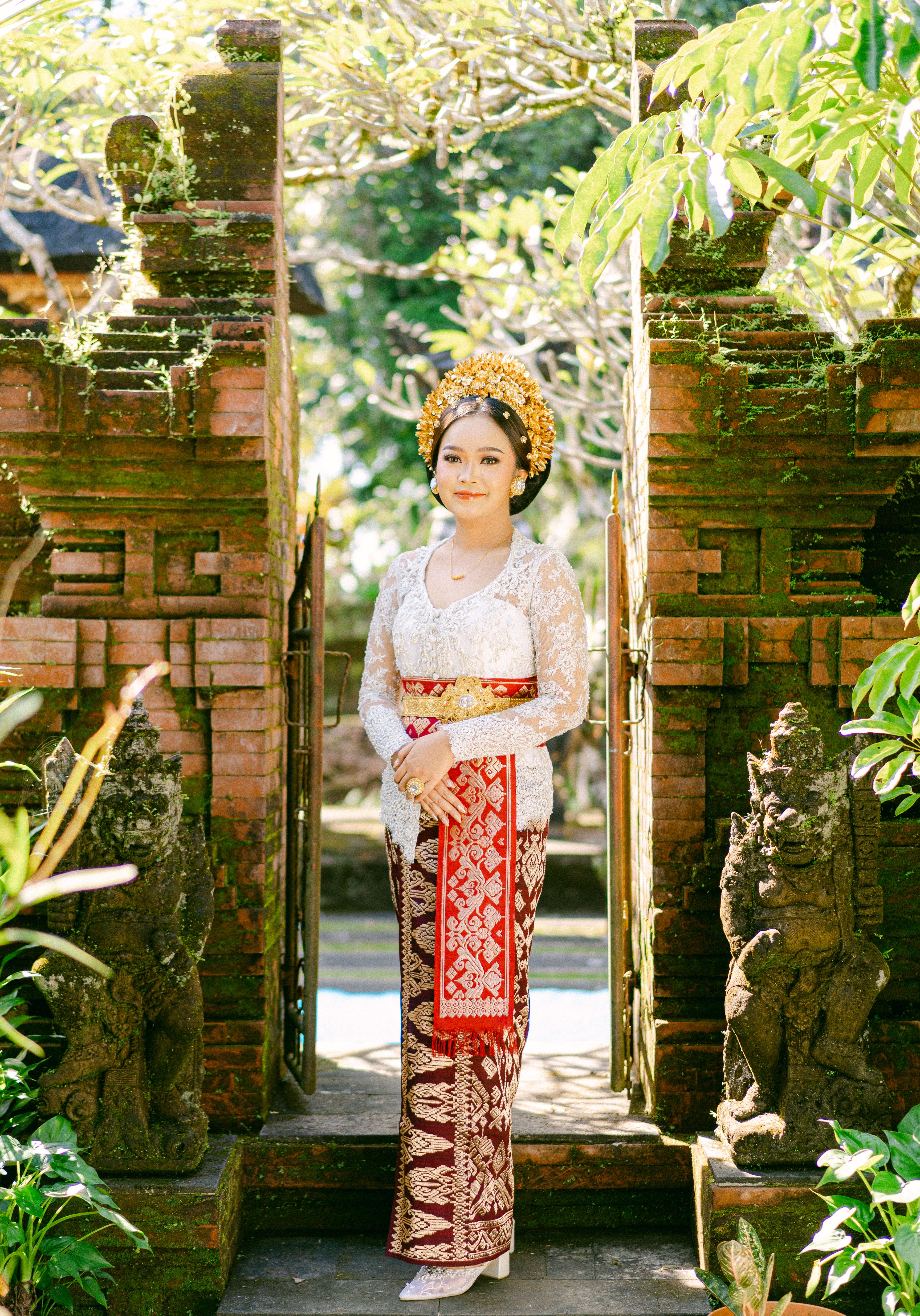 Traditional Balinese Attire in Garden Temple · Free Stock Photo