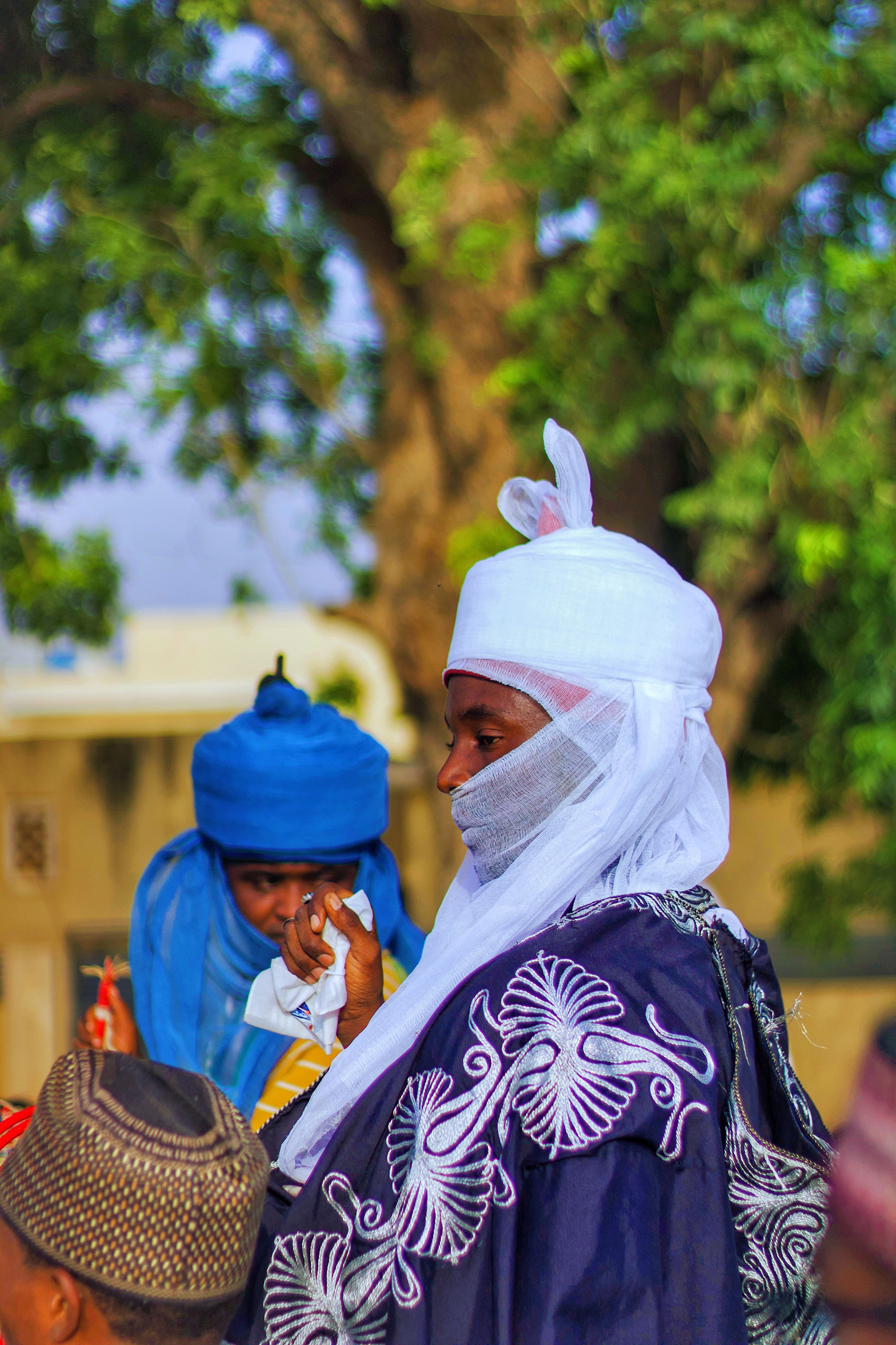 Traditional Attire at Cultural Gathering Outdoors · Free Stock Photo