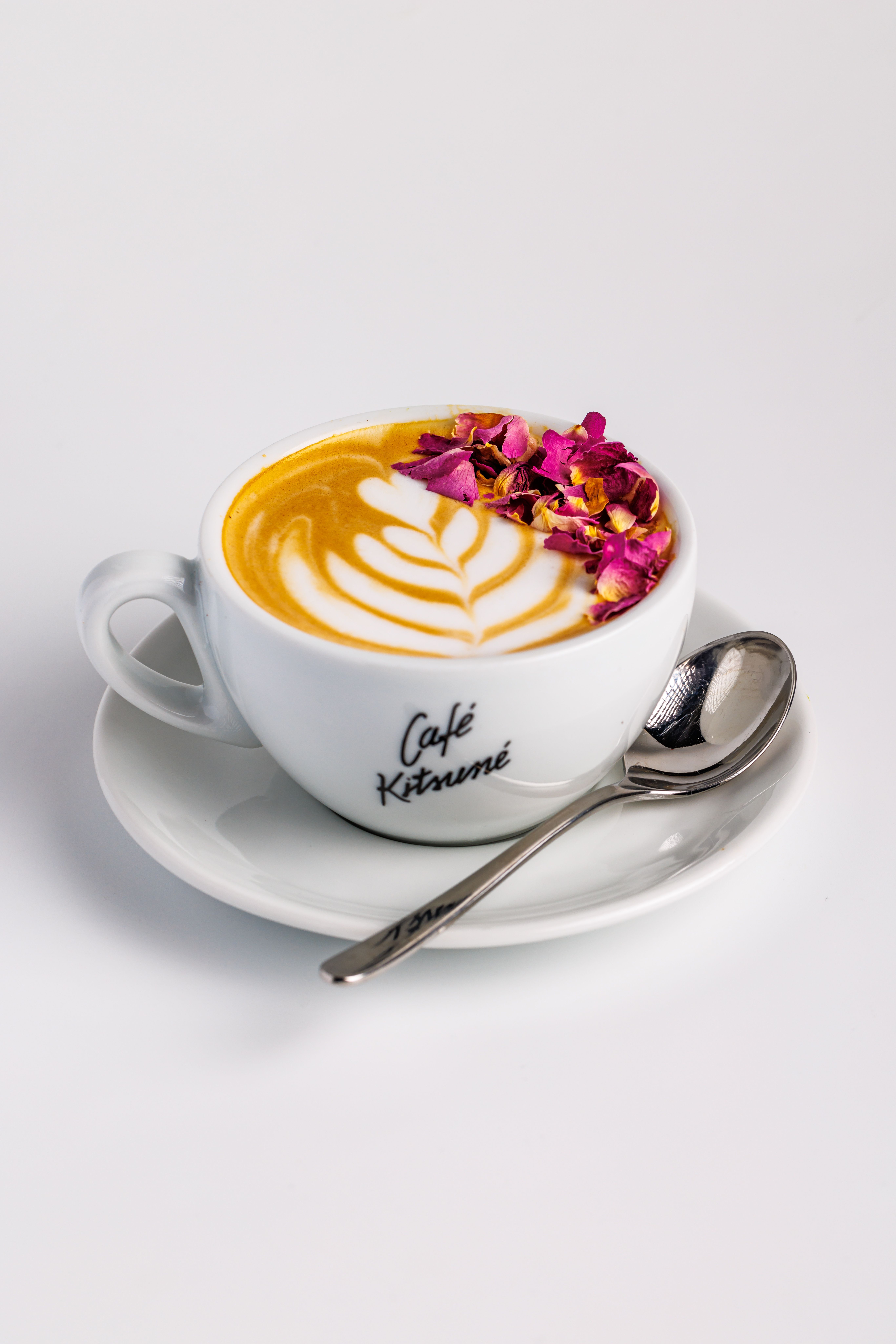 Elegant Latte Art with Rose Petals at Café Kitsuné · Free Stock Photo