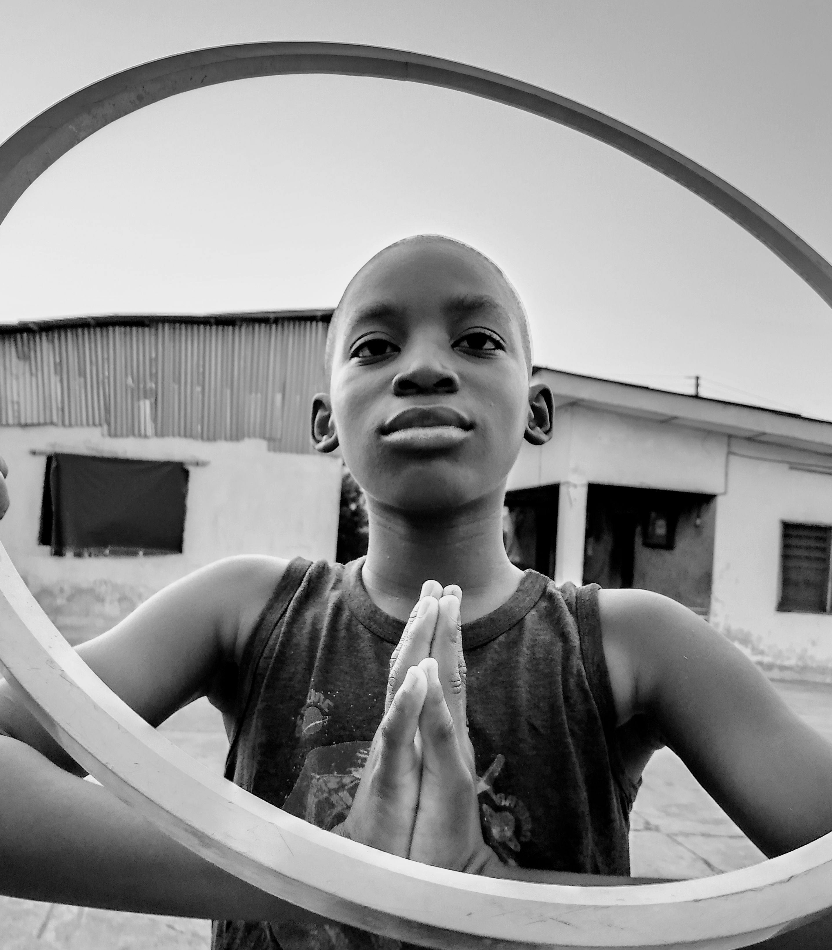 Black and White Portrait of a Young Boy with Hoop · Free Stock Photo