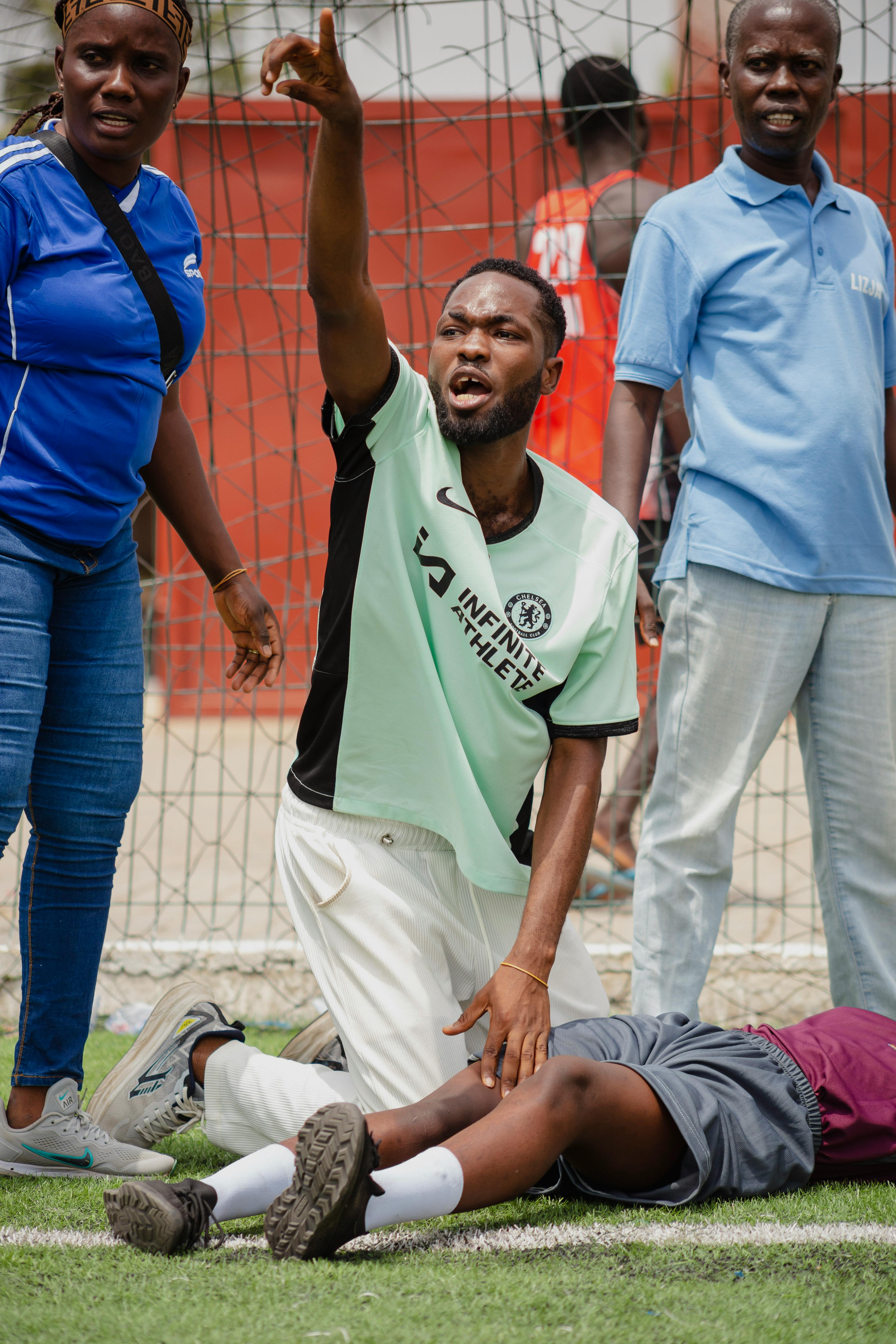 Soccer Match Incident with First Aid Intervention · Free Stock Photo