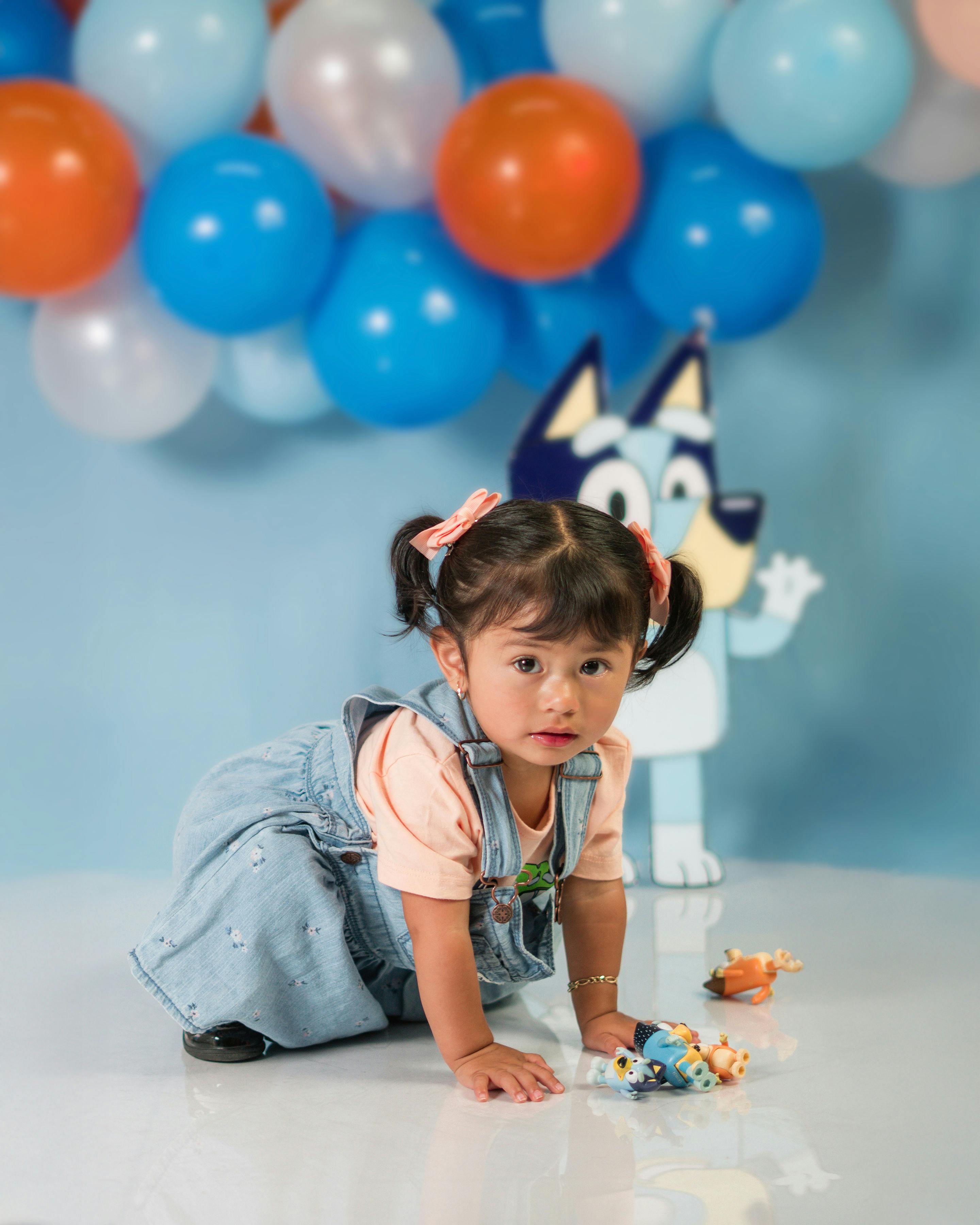 Adorable Child Crawling Amidst Colorful Balloons · Free Stock Photo
