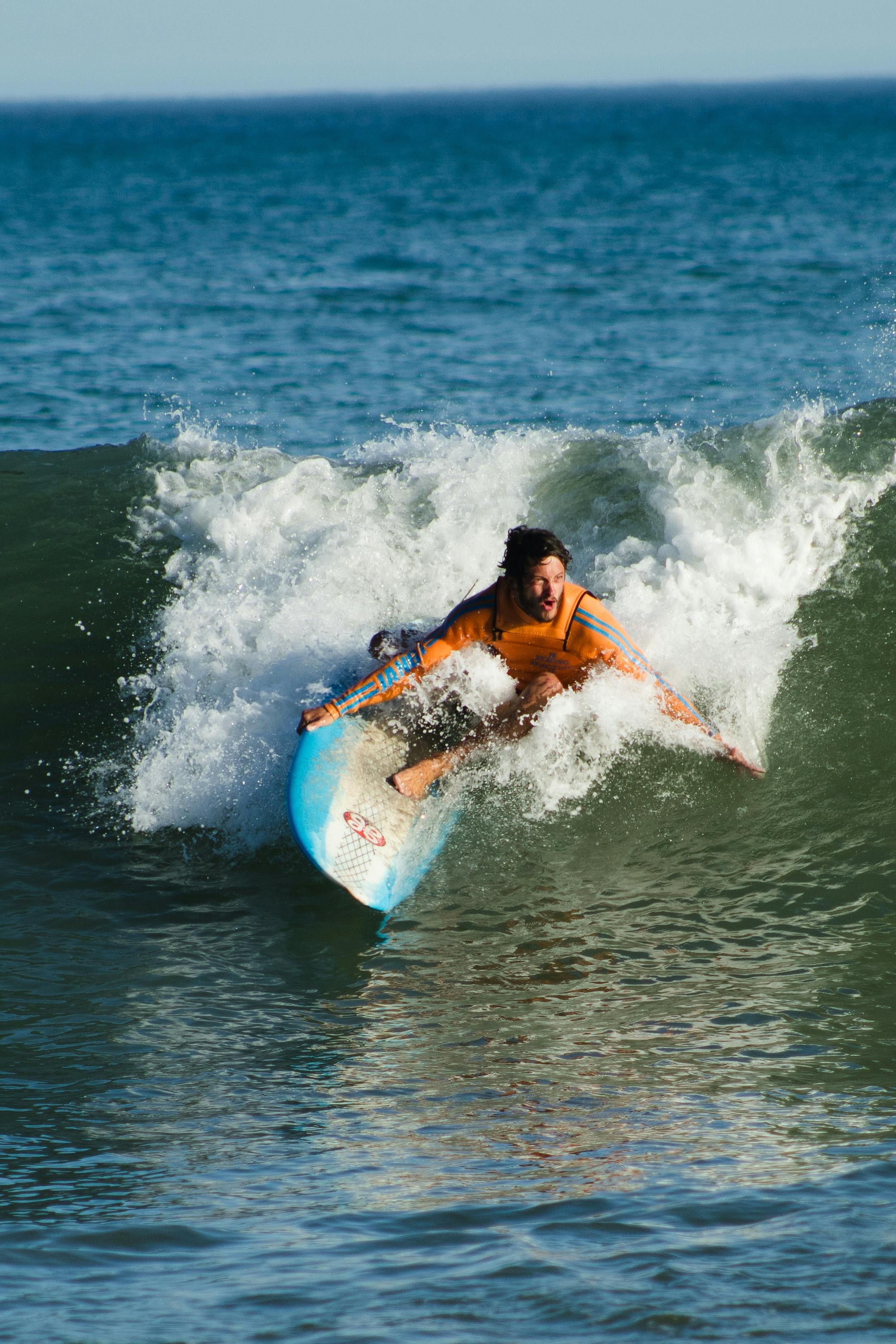 Dynamic Surfing Action on Ocean Wave · Free Stock Photo