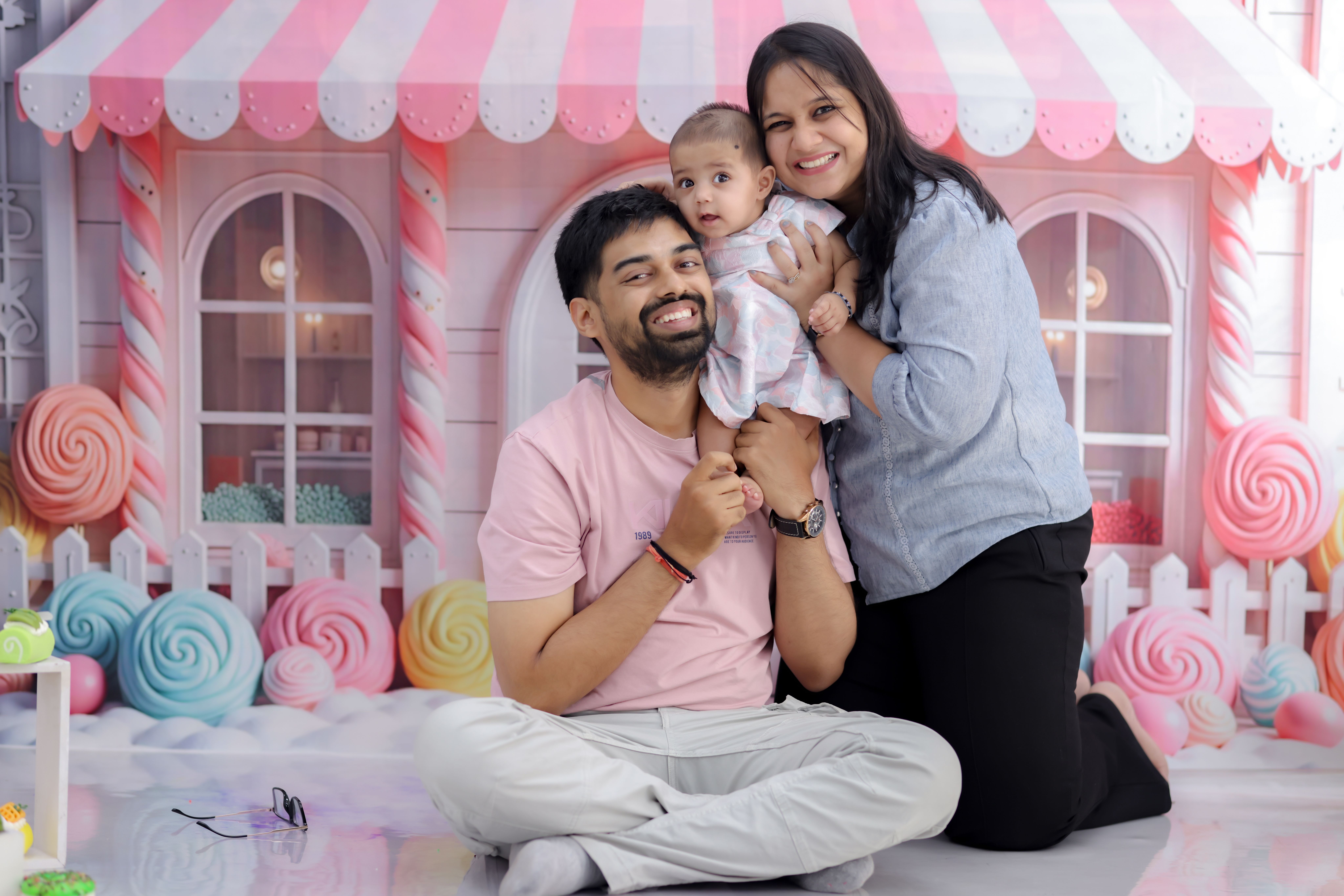 Happy Family Portrait in Candyland Themed Setting · Free Stock Photo