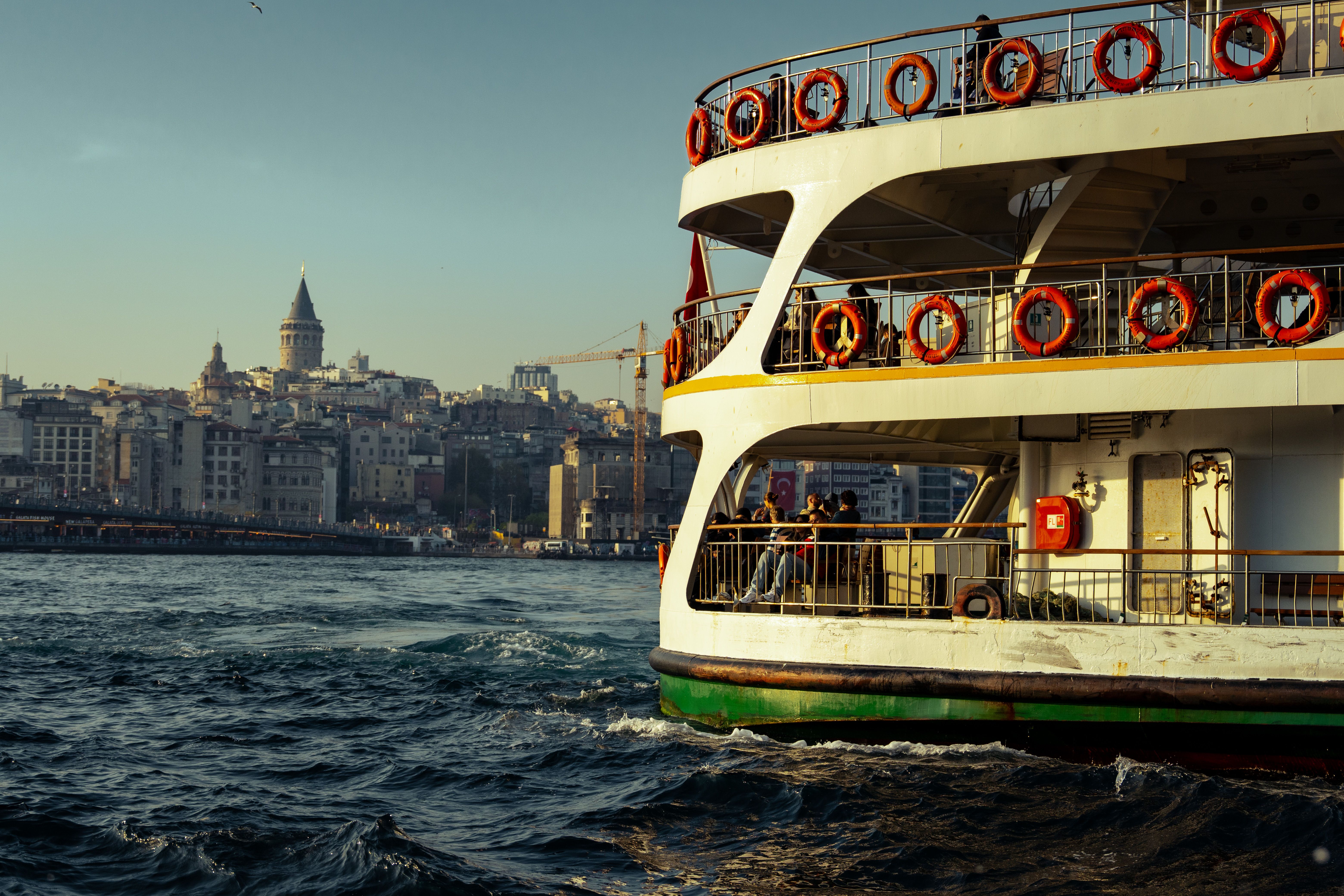 Ferry Approaching Istanbul's Historic Galata Tower · Free Stock Photo