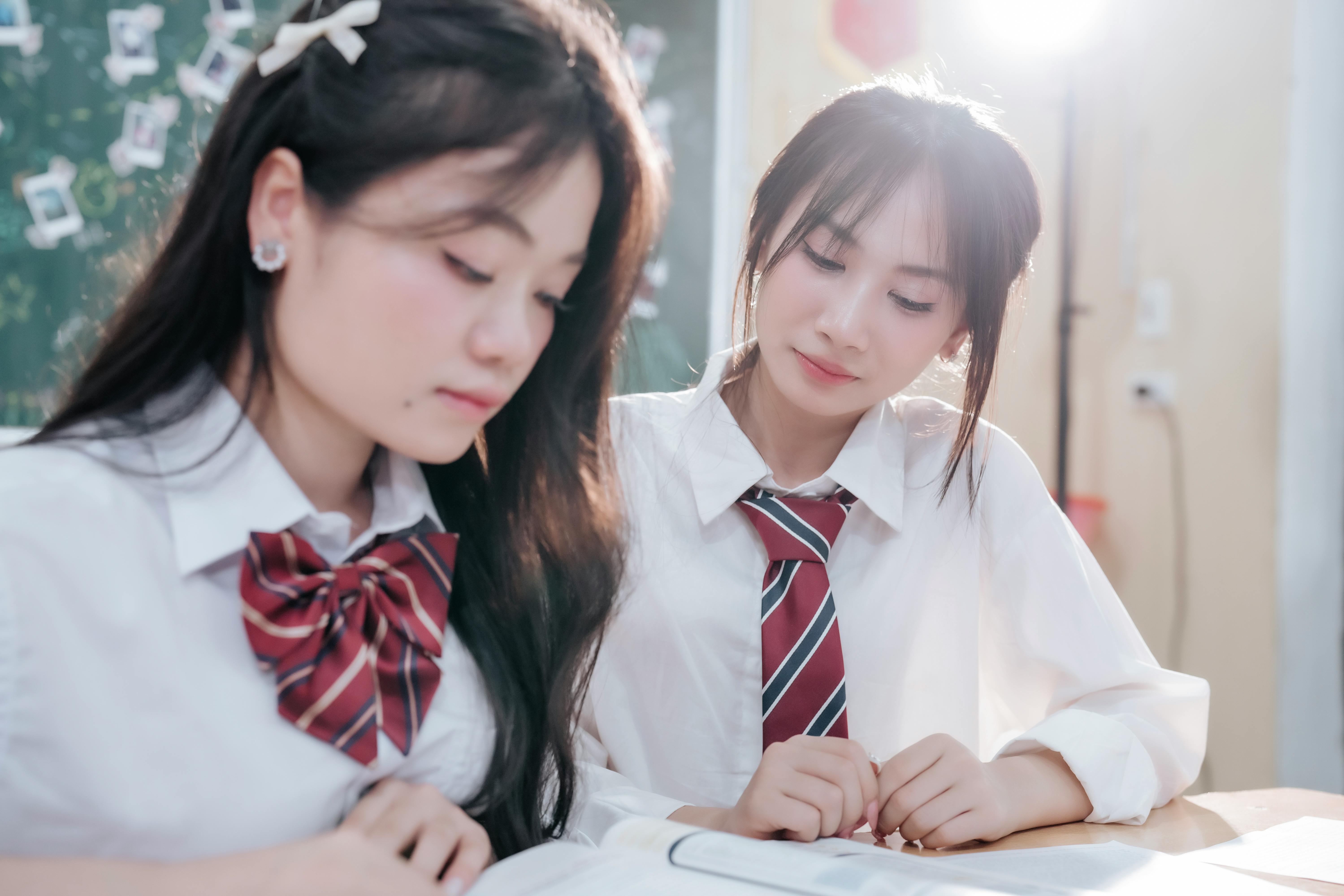 Two Students Studying Together in Classroom · Free Stock Photo