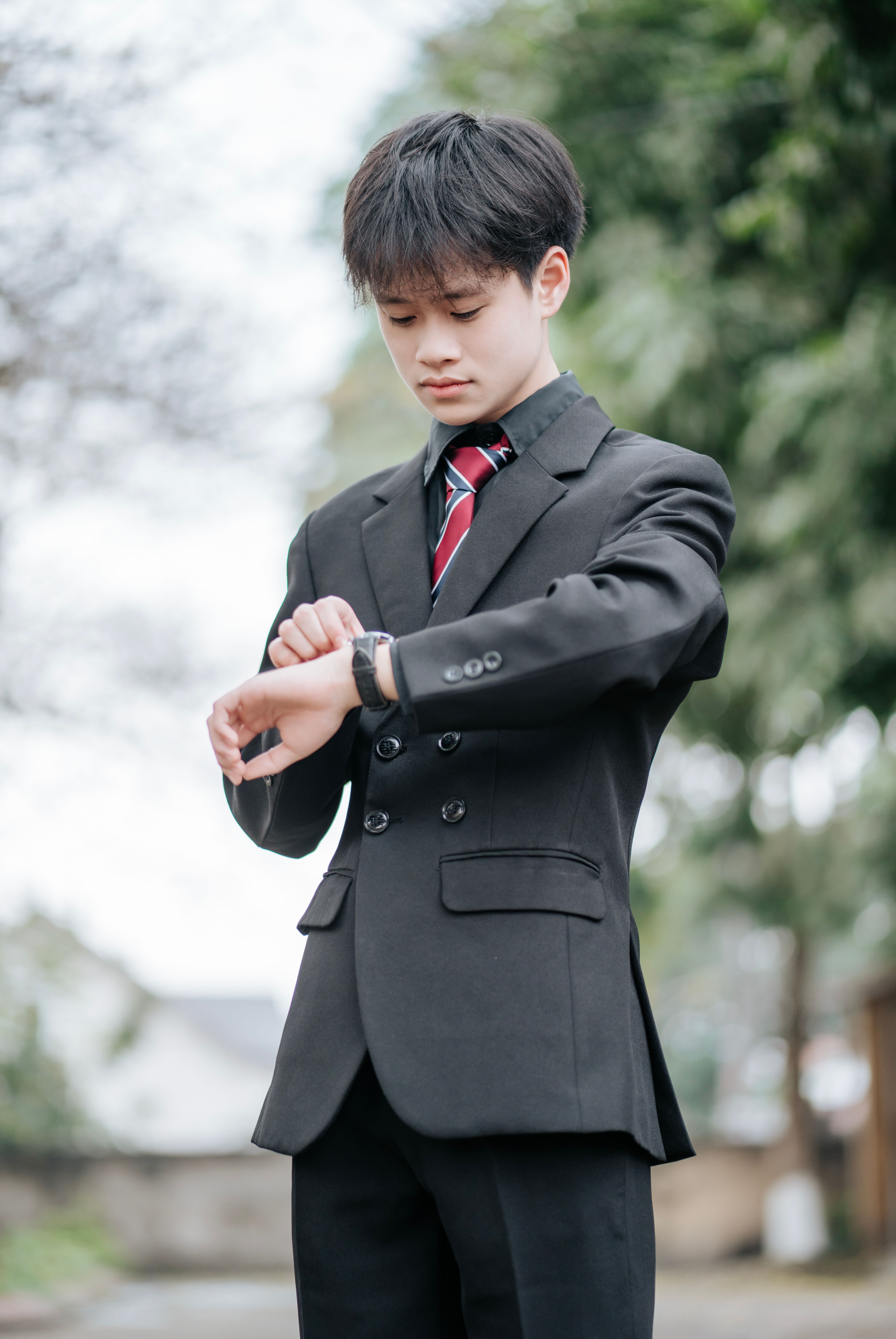 Young Professional Man Checking Watch Outdoors · Free Stock Photo