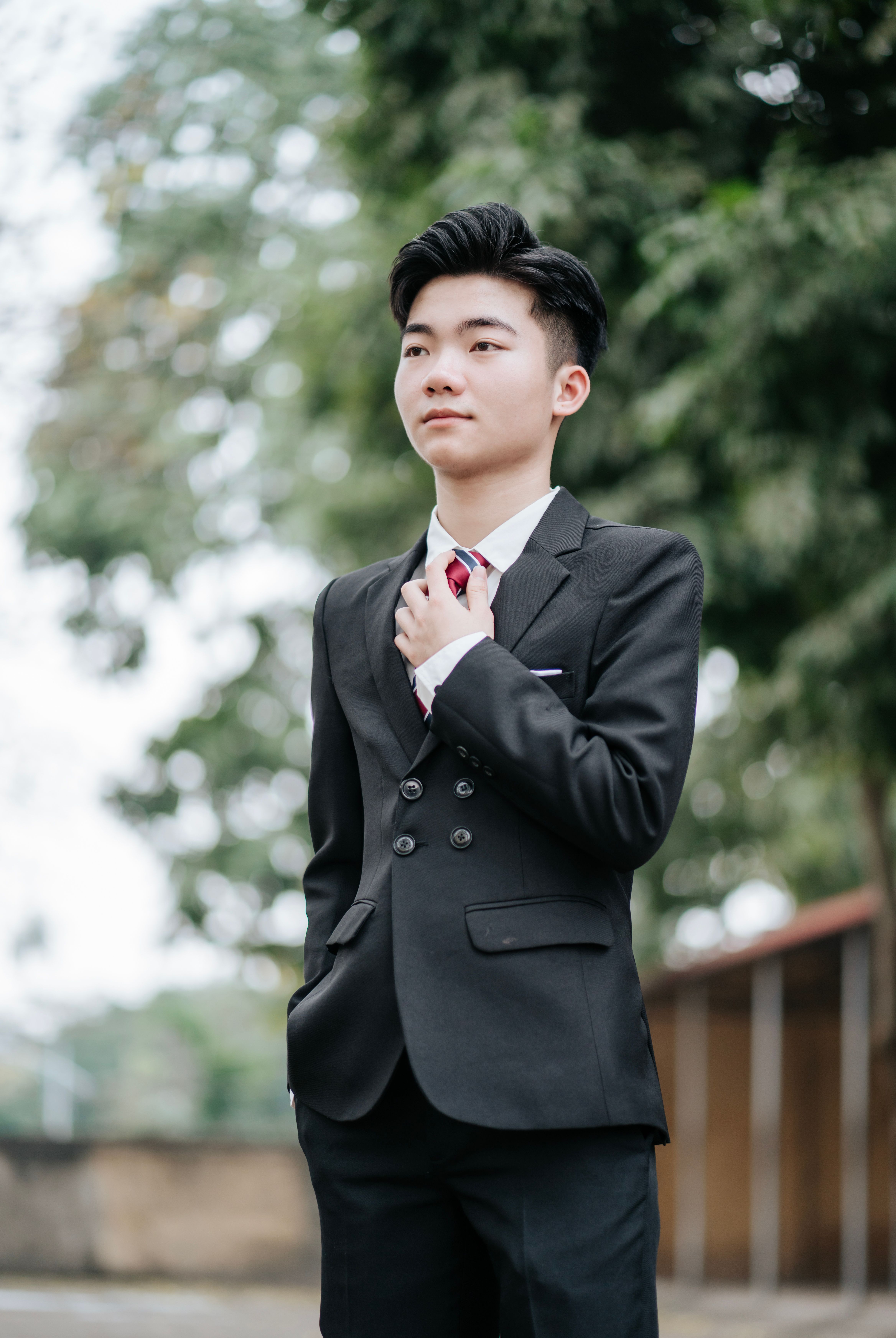 Confident Teenage Boy in Formal Suit Outdoors · Free Stock Photo