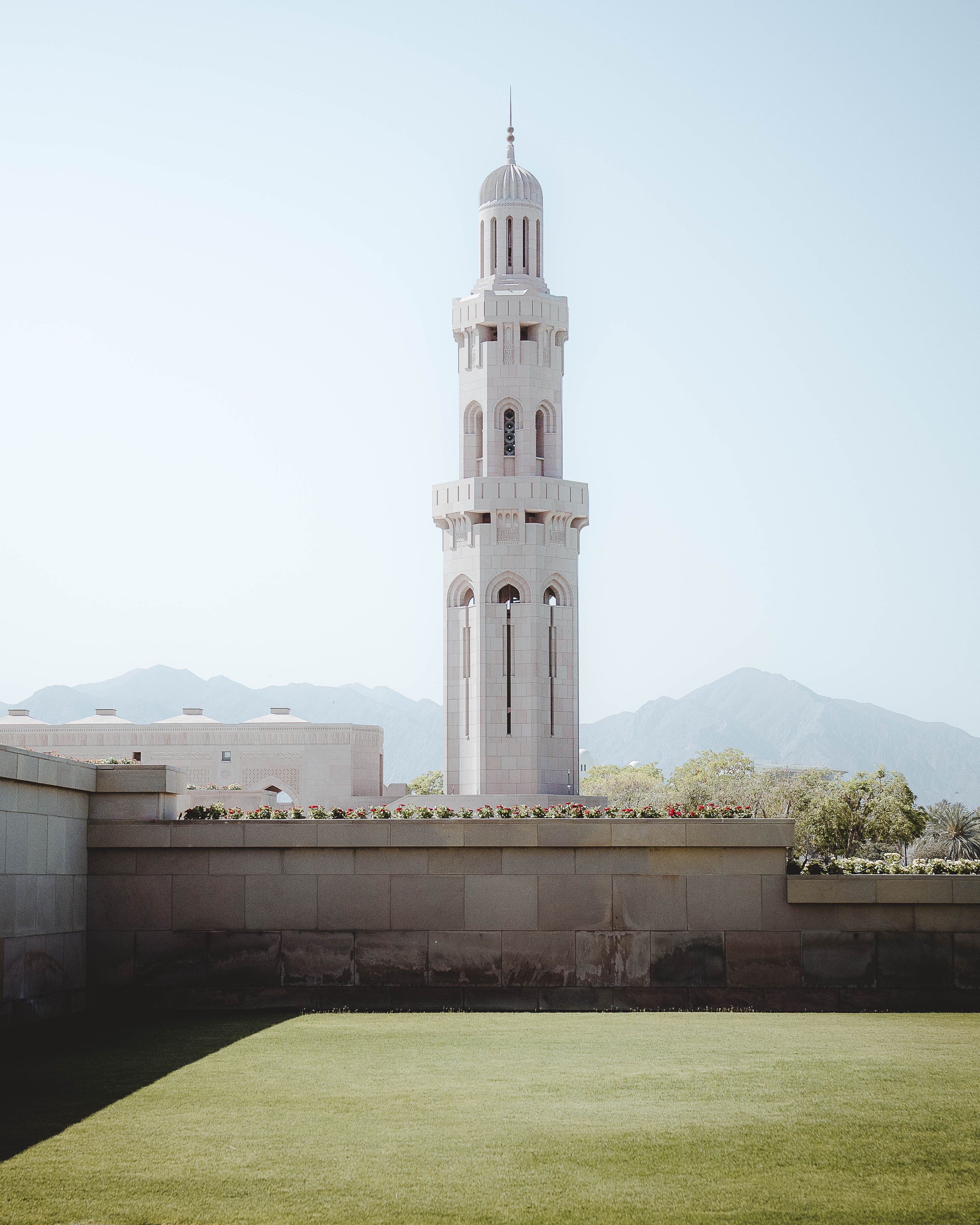 Majestic Minaret with Mountain Backdrop · Free Stock Photo