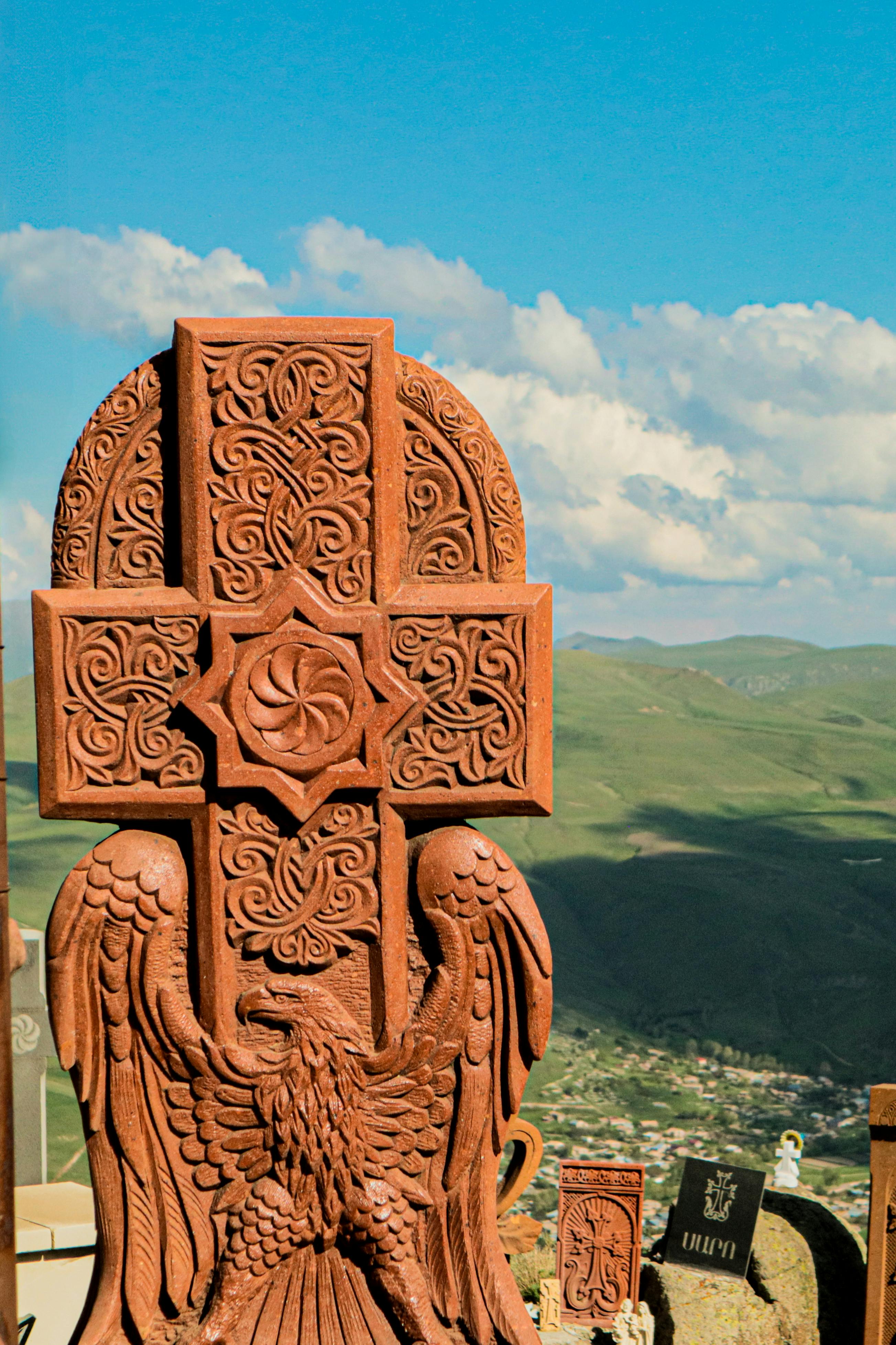 Intricately Carved Armenian Khachkar in Scenic Landscape · Free Stock Photo