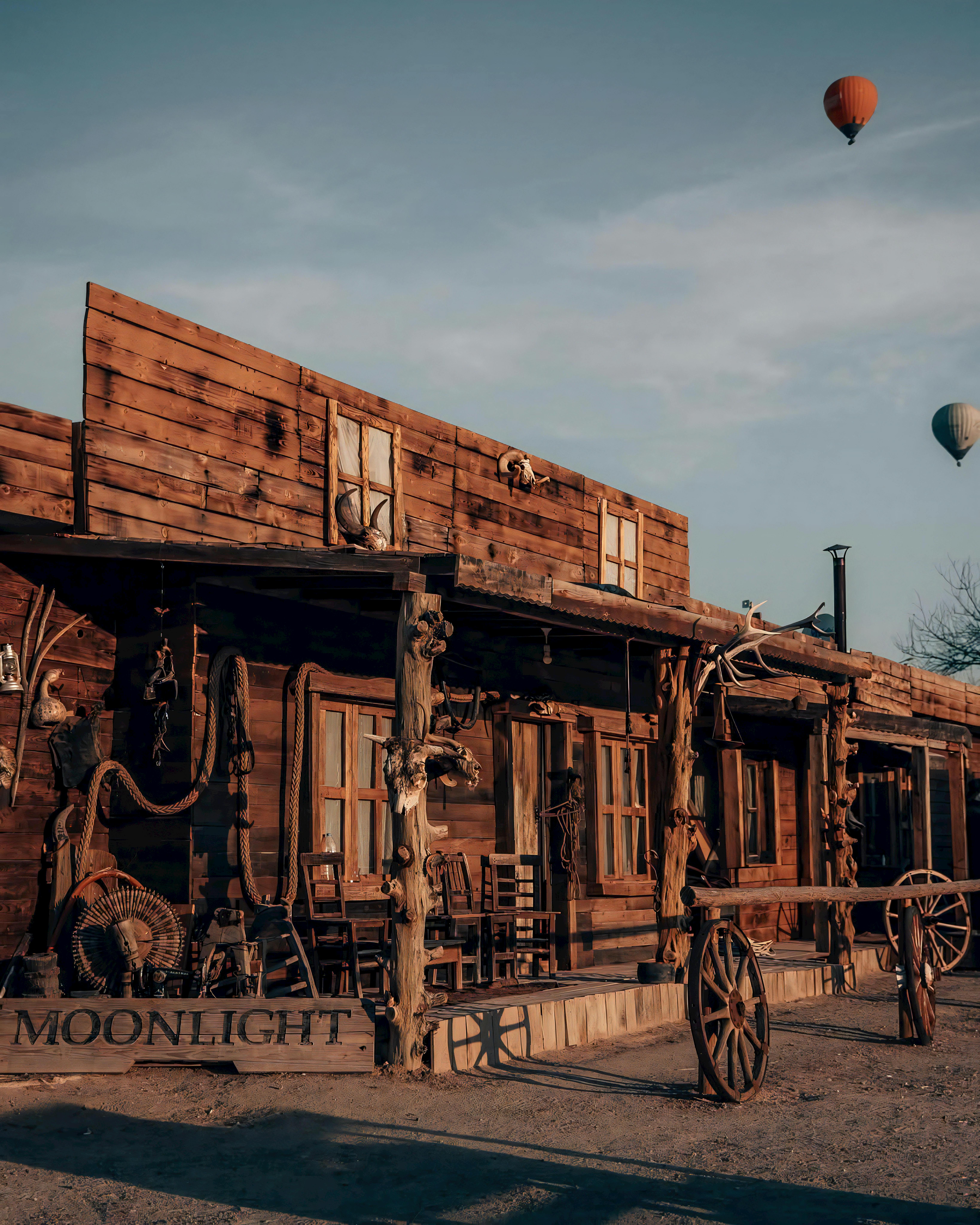 Rustic Wooden Ranch with Hot Air Balloons · Free Stock Photo