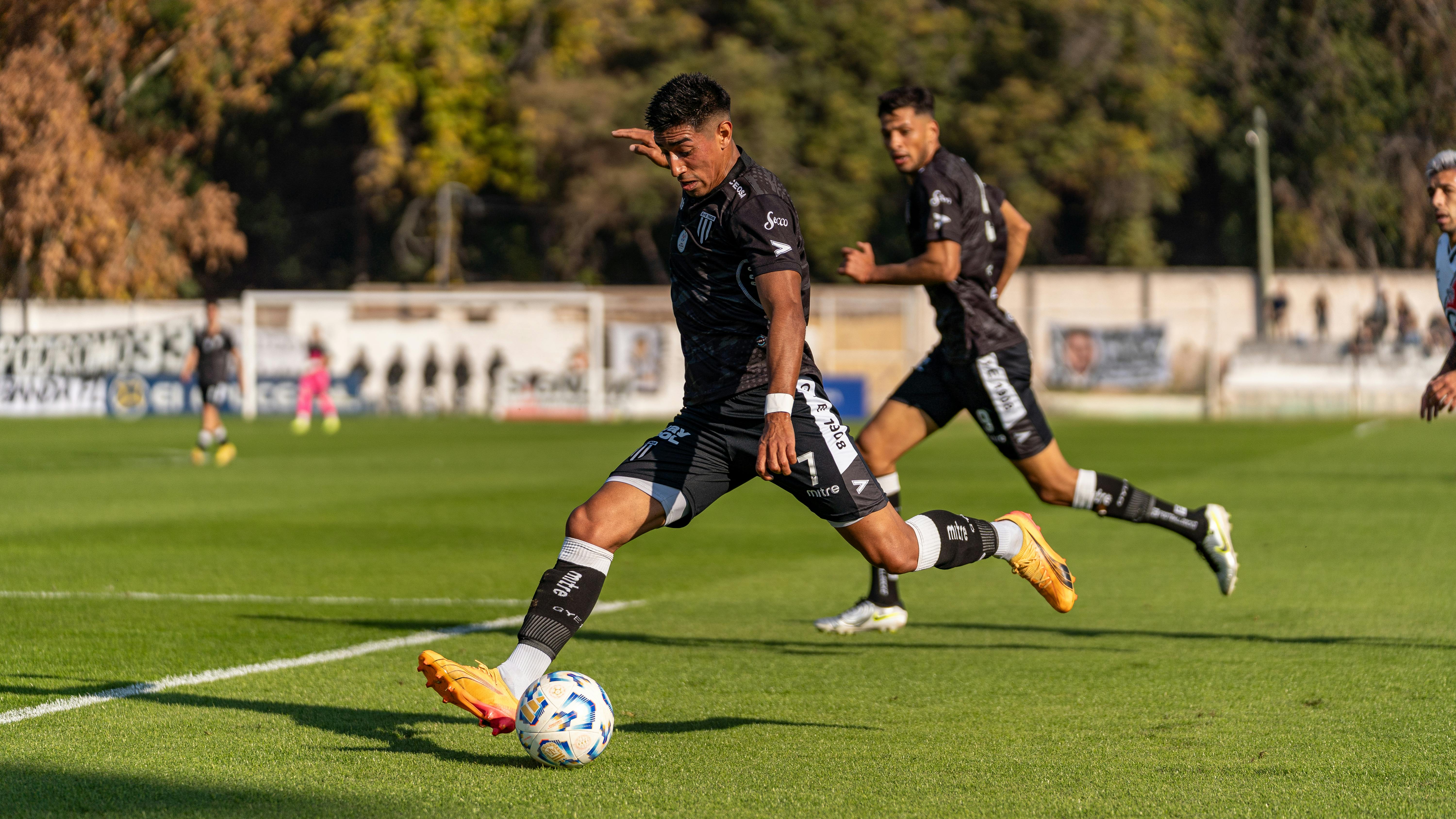 Exciting Football Match Action Shot on Field · Free Stock Photo