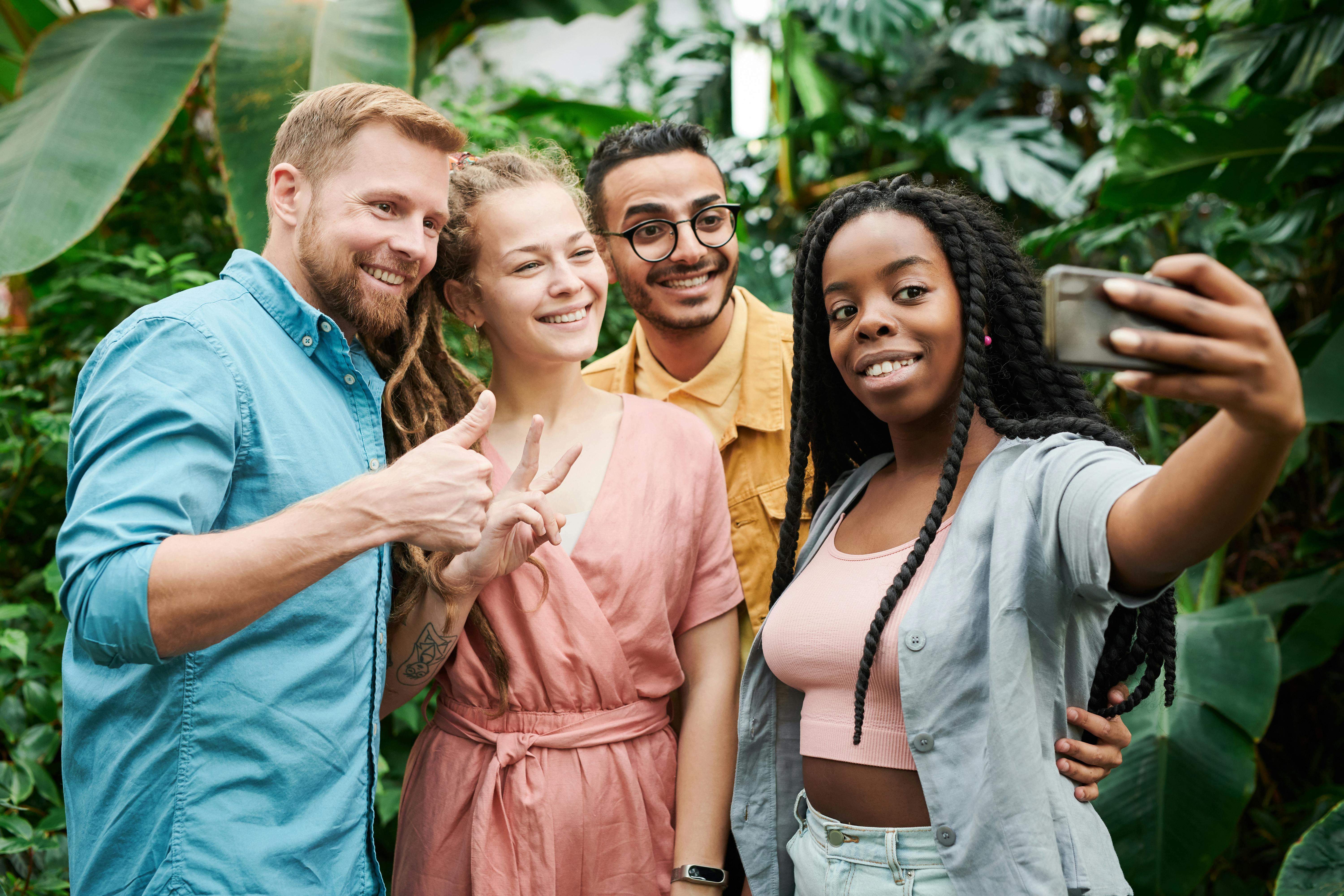 Photo Of People Looking At Photograph · Free Stock Photo