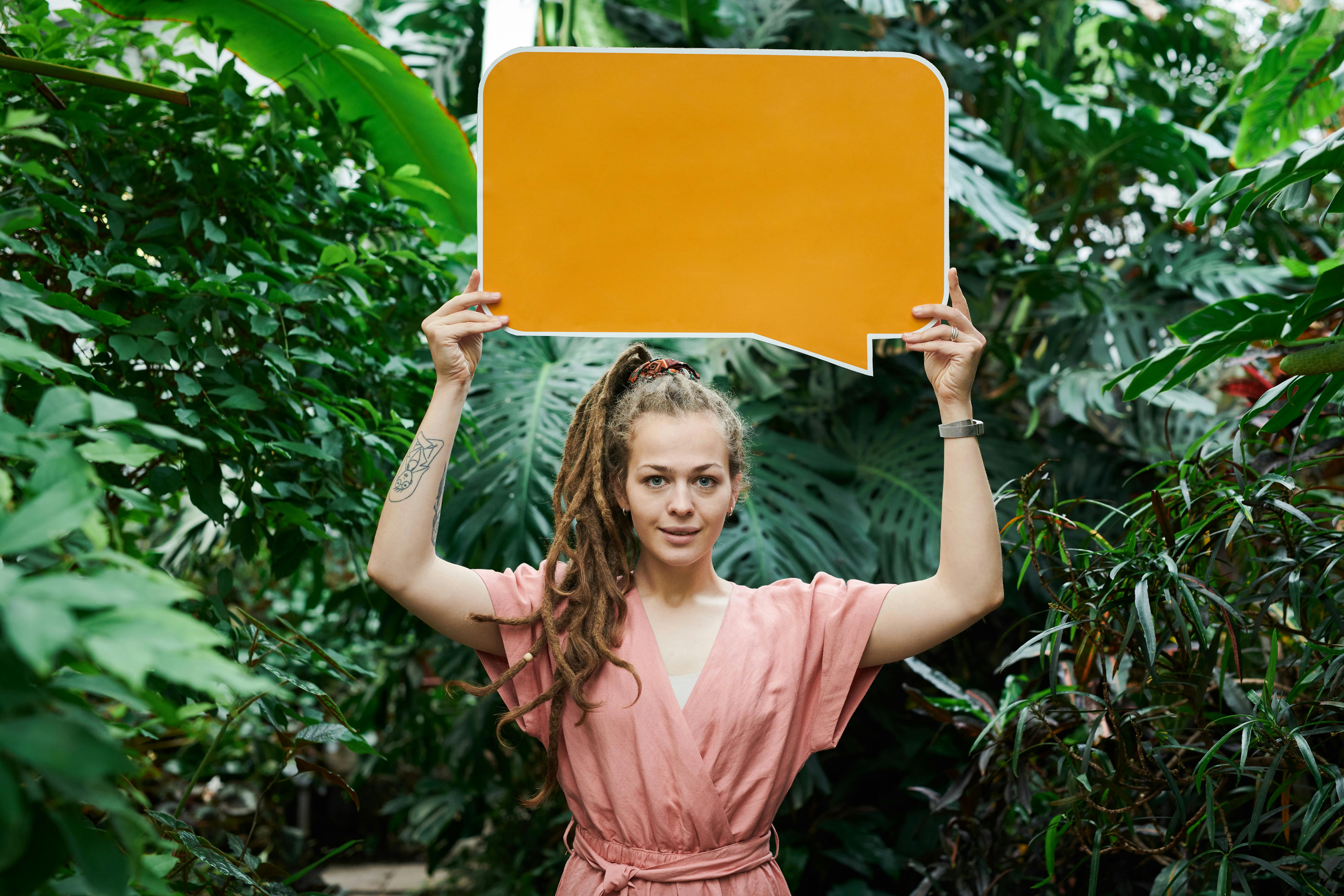 Photo Of Woman Holding Sign Board · Free Stock Photo
