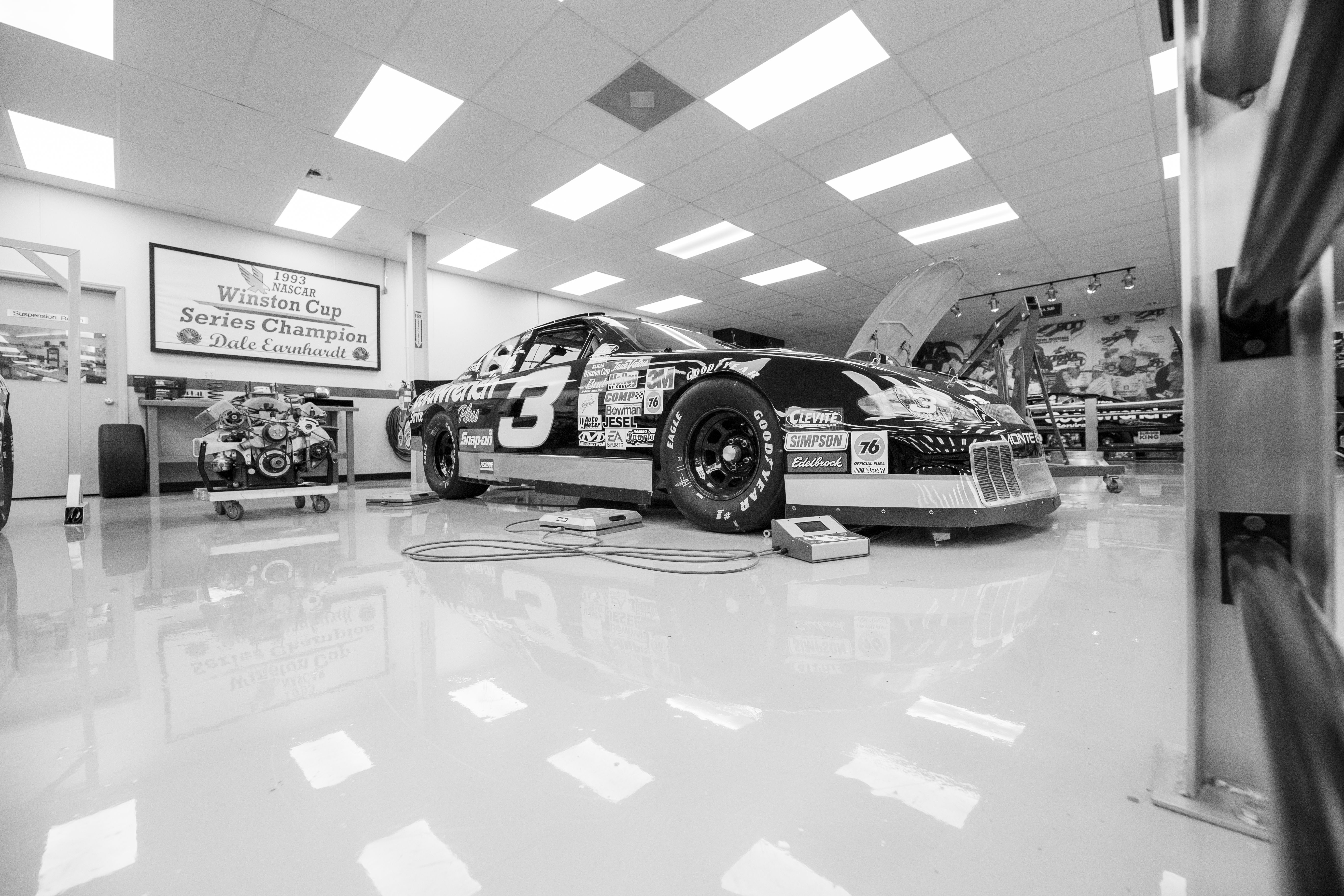 Classic Race Car in Workshop, Black and White Photo · Free Stock Photo