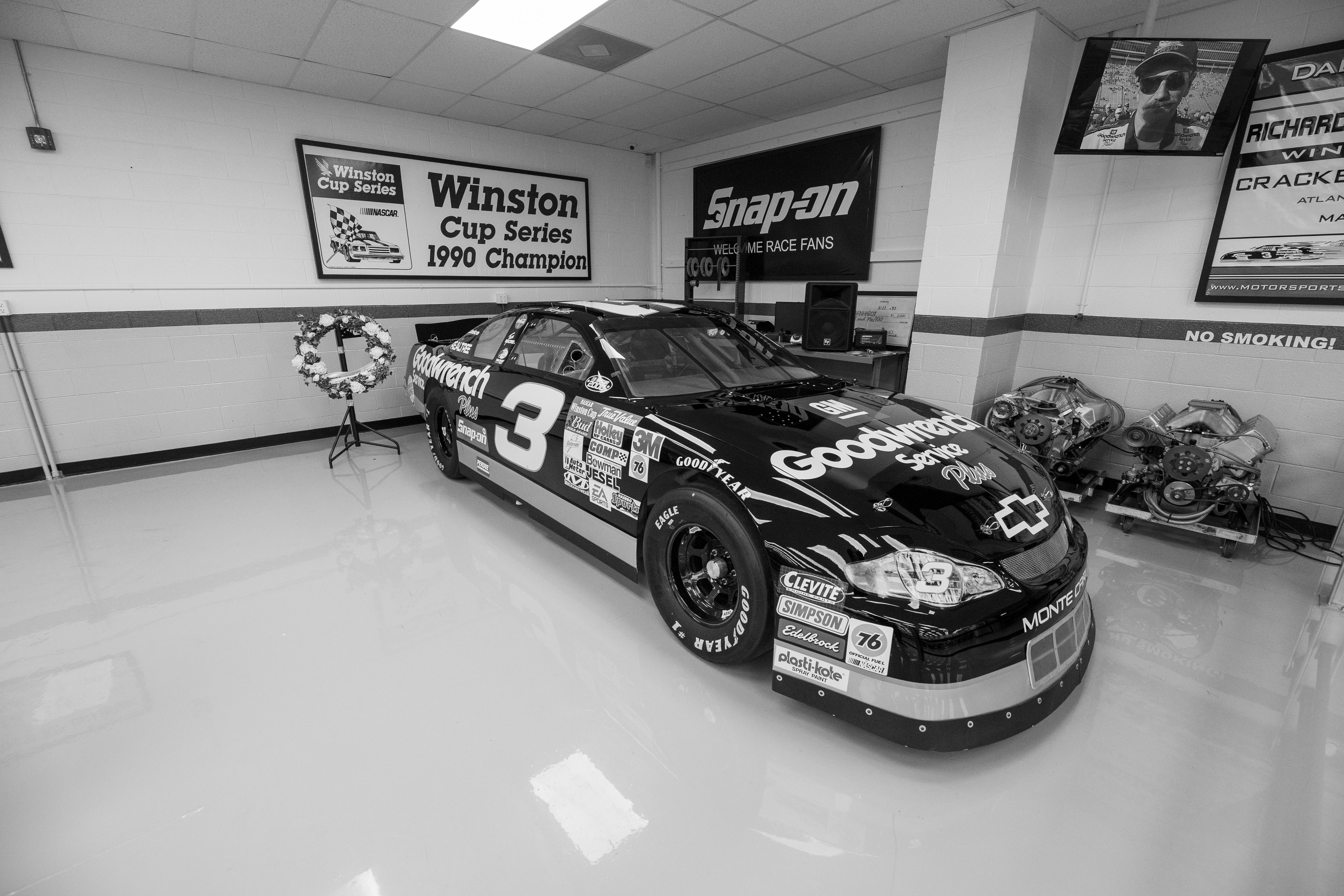 Black and White NASCAR Race Car in Garage Museum · Free Stock Photo