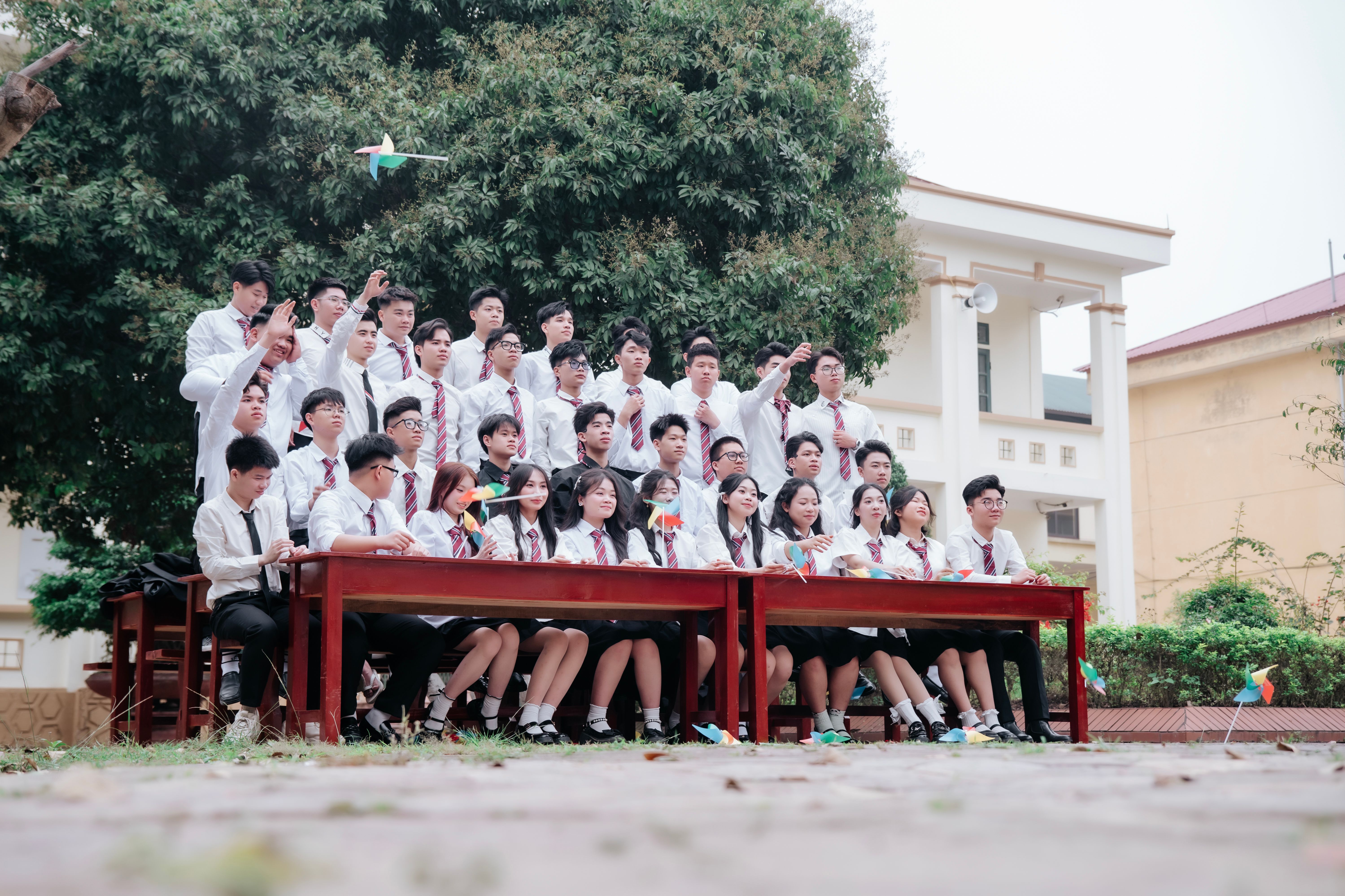 High school students celebrating outdoors · Free Stock Photo