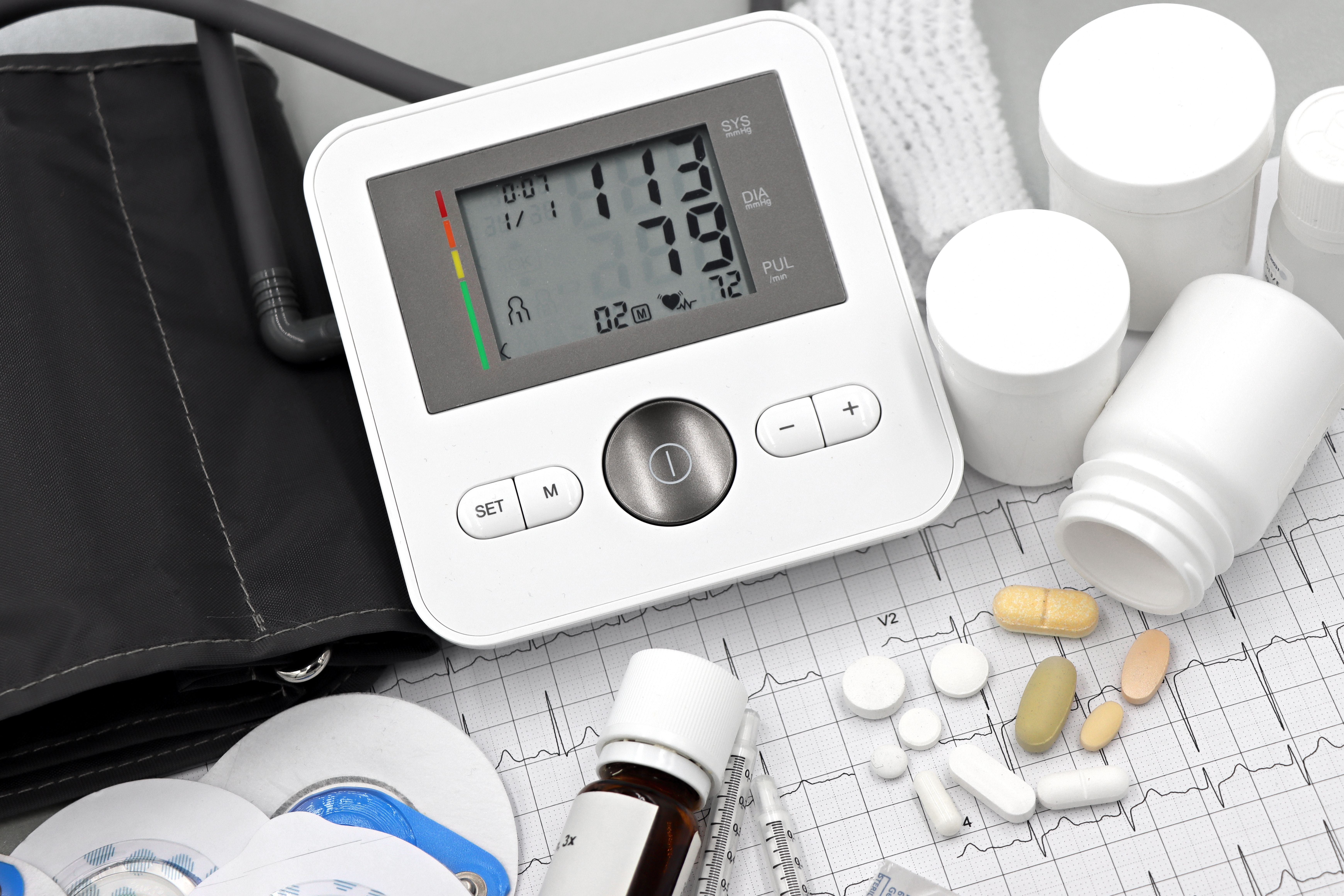 Digital Blood Pressure Monitor with Medication · Free Stock Photo