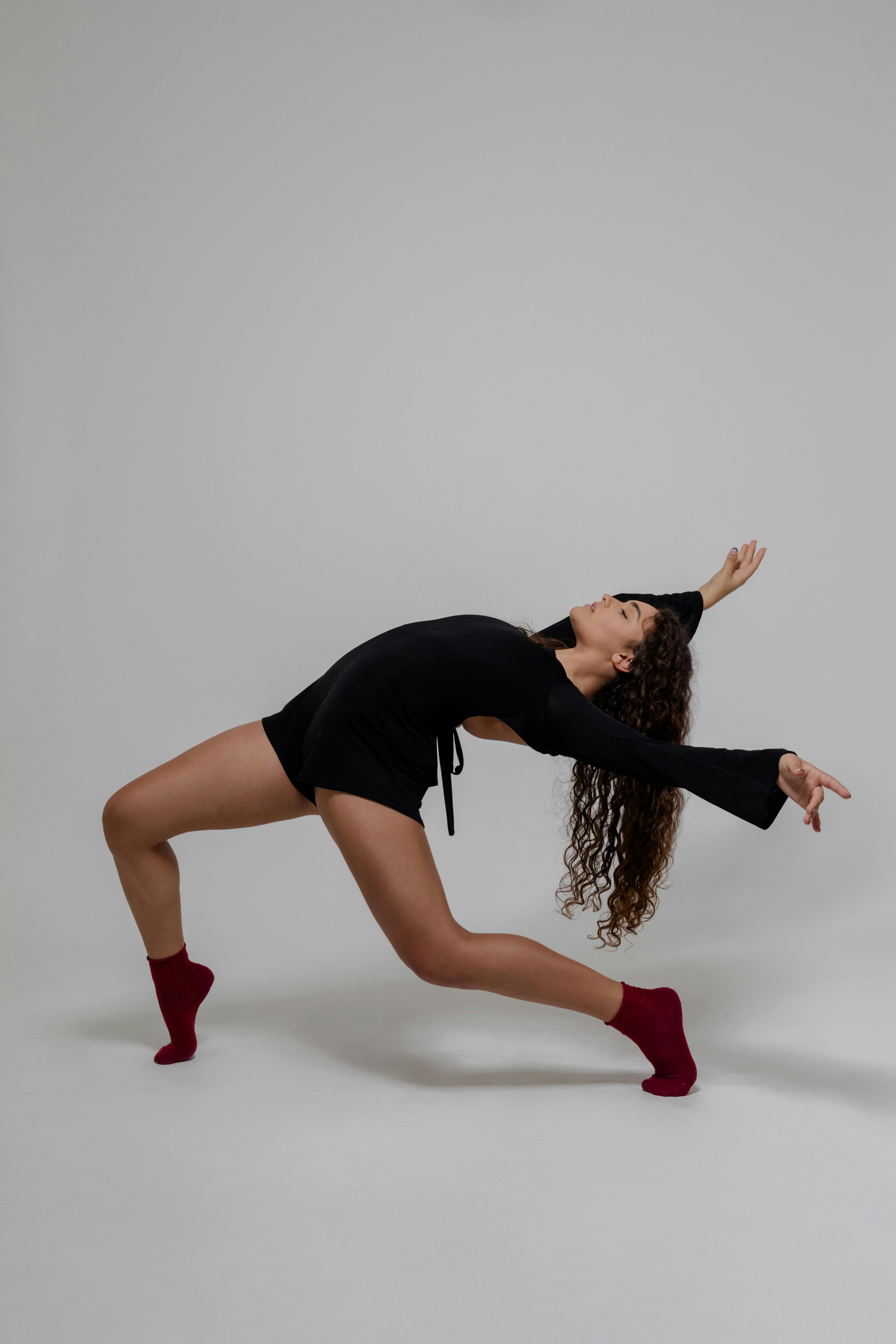 Contemporary Dance Pose in Studio Setting · Free Stock Photo