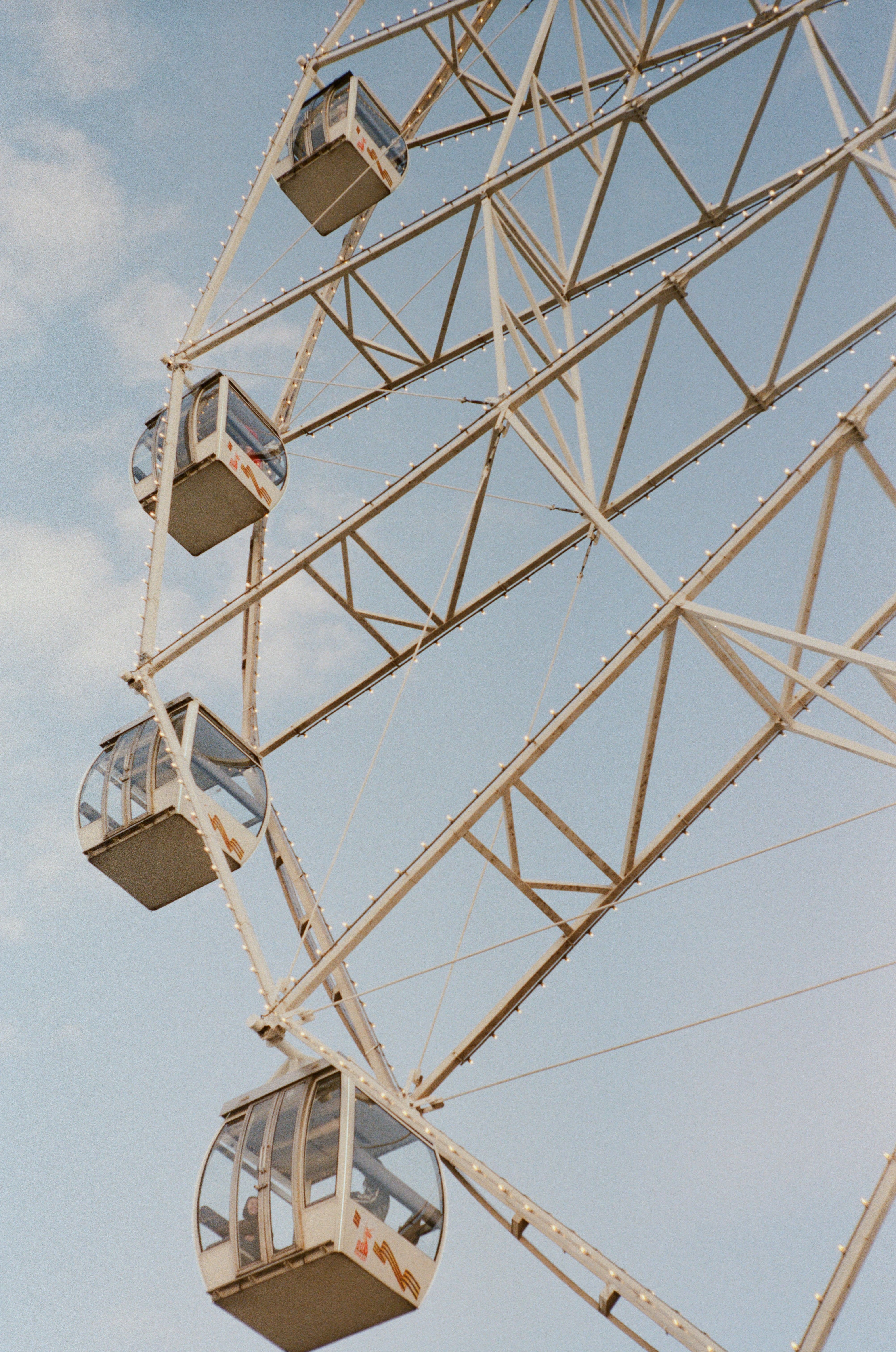 Close-up of a Ferris Wheel Against Clear Sky · Free Stock Photo