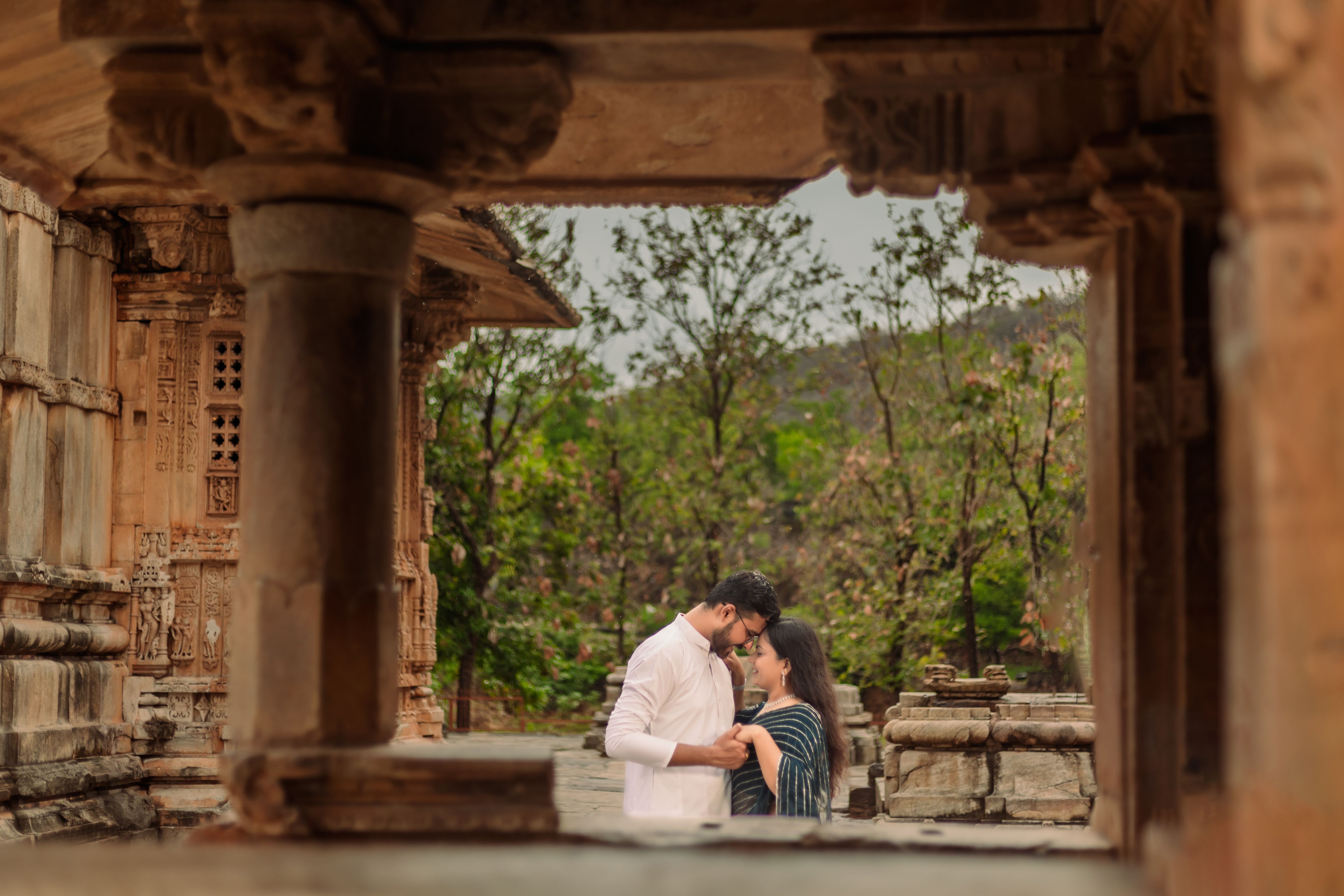 Romantic Couple Embracing in Ancient Temple Ruins · Free Stock Photo