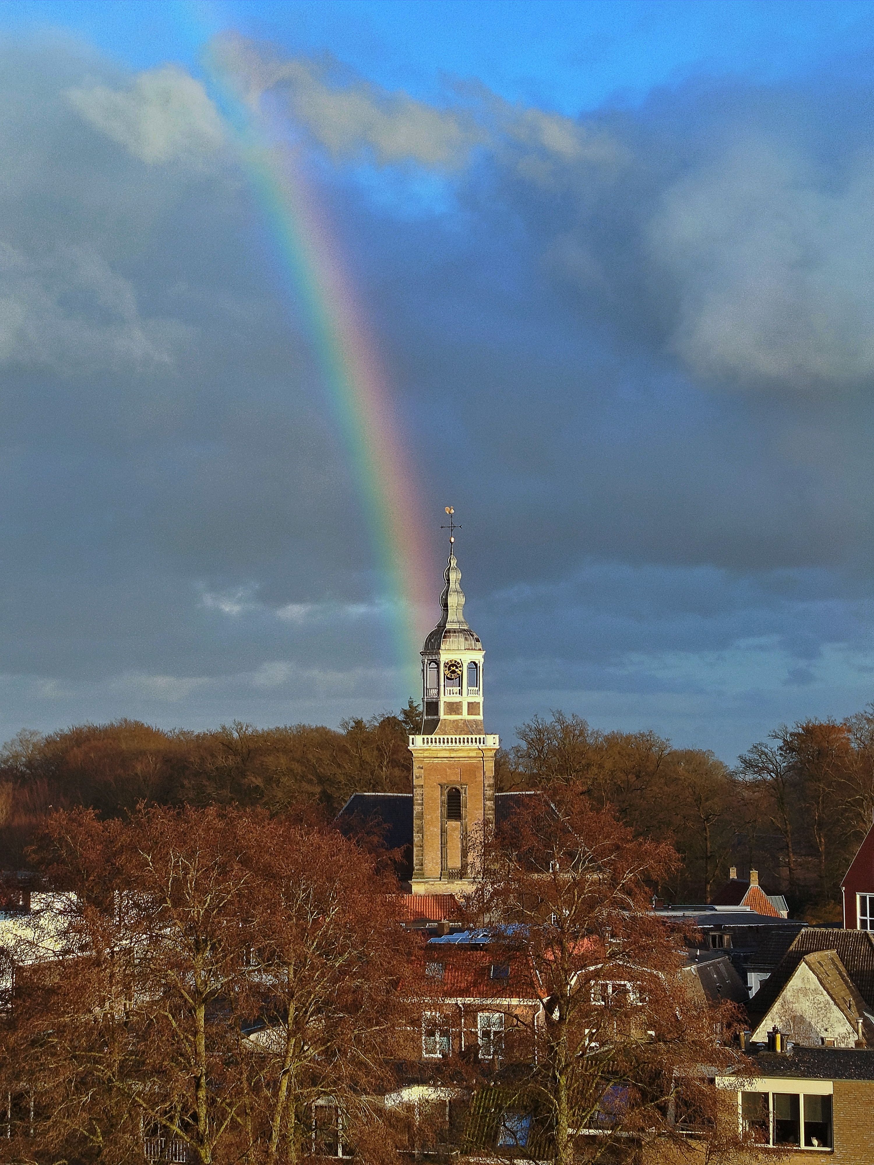 Rainbow Over Church Tower in Almelo · Free Stock Photo