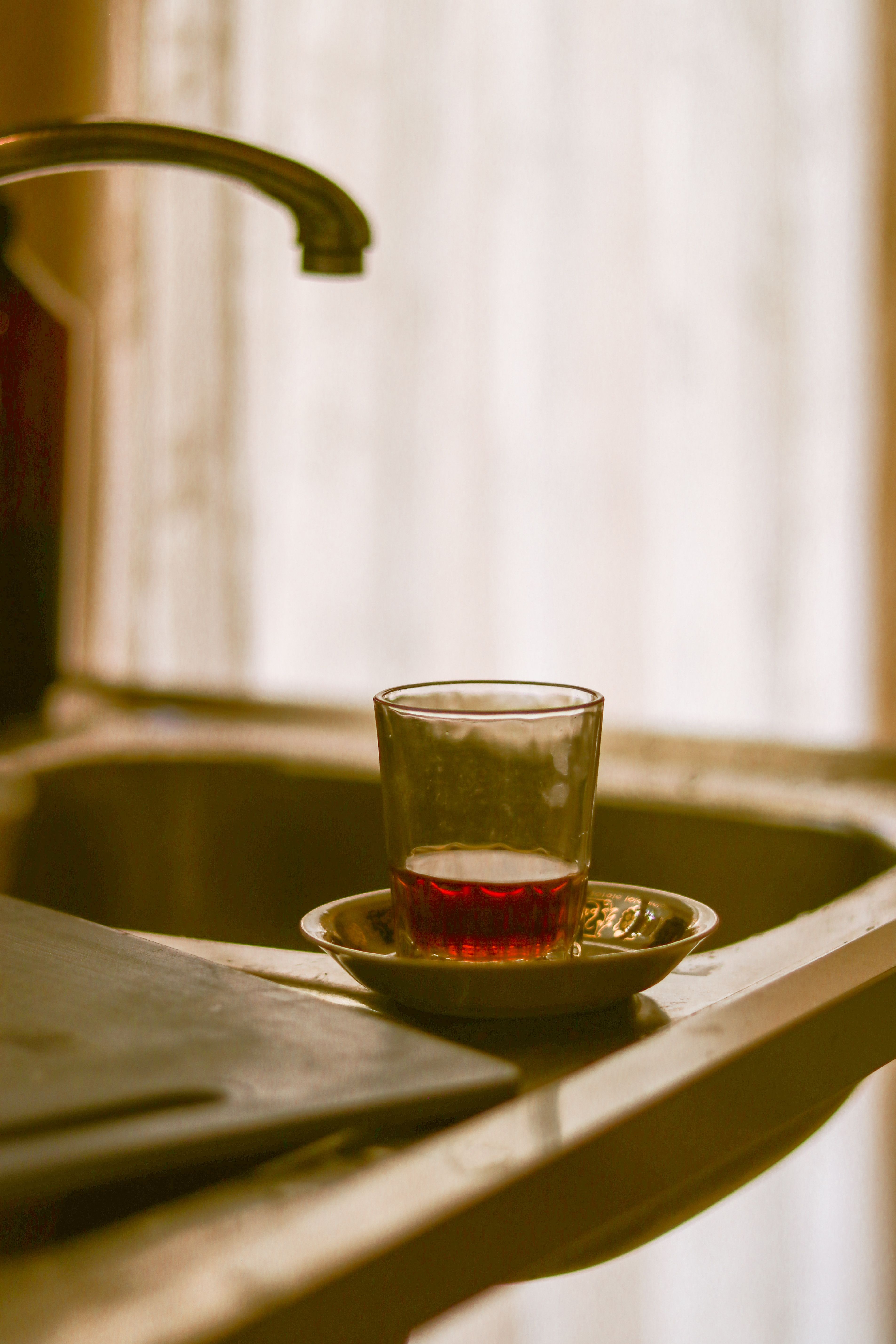 Rustic Glass of Tea by Kitchen Sink · Free Stock Photo