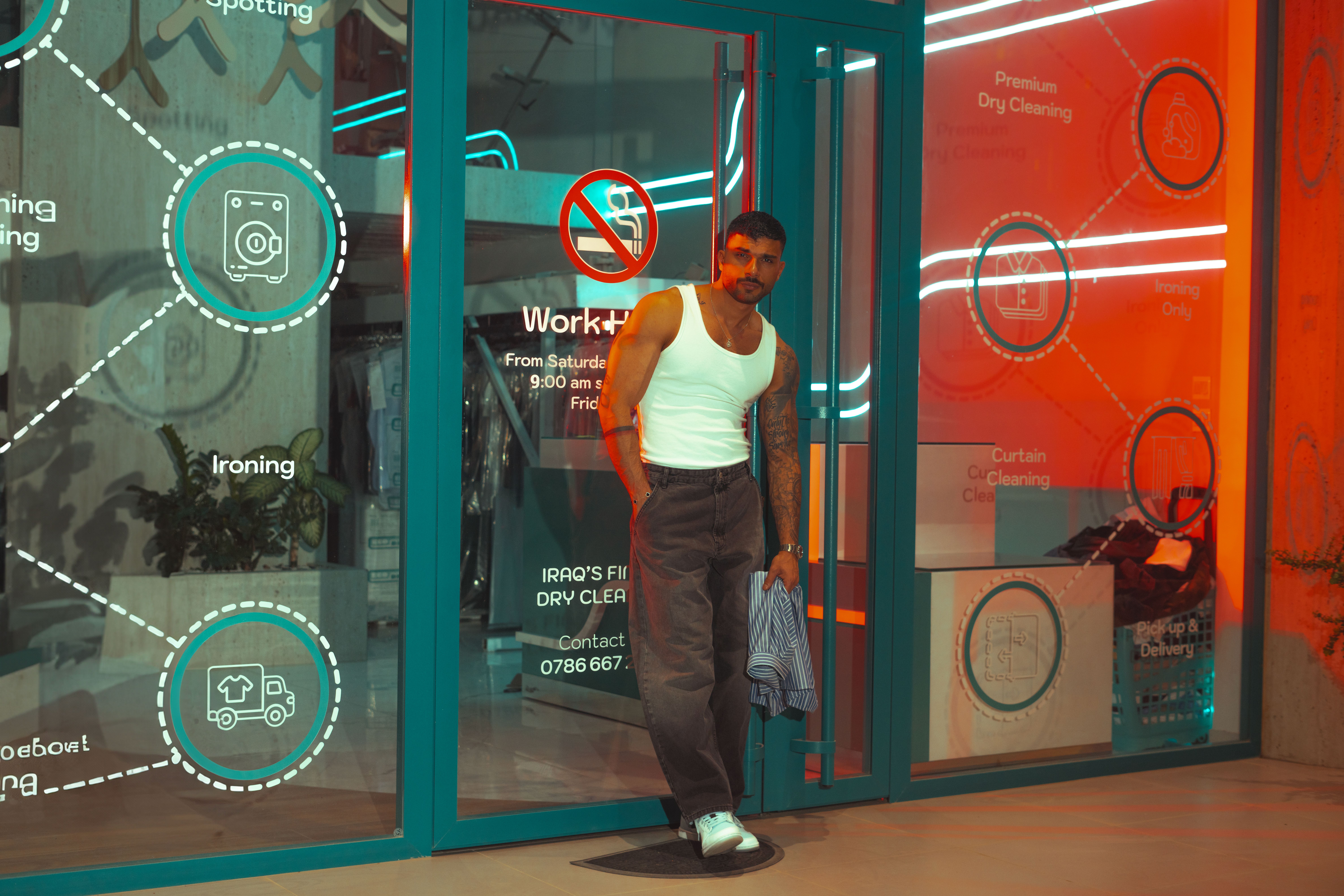 Stylish Man Standing Outside a Dry Cleaning Store in Baghdad · Free ...