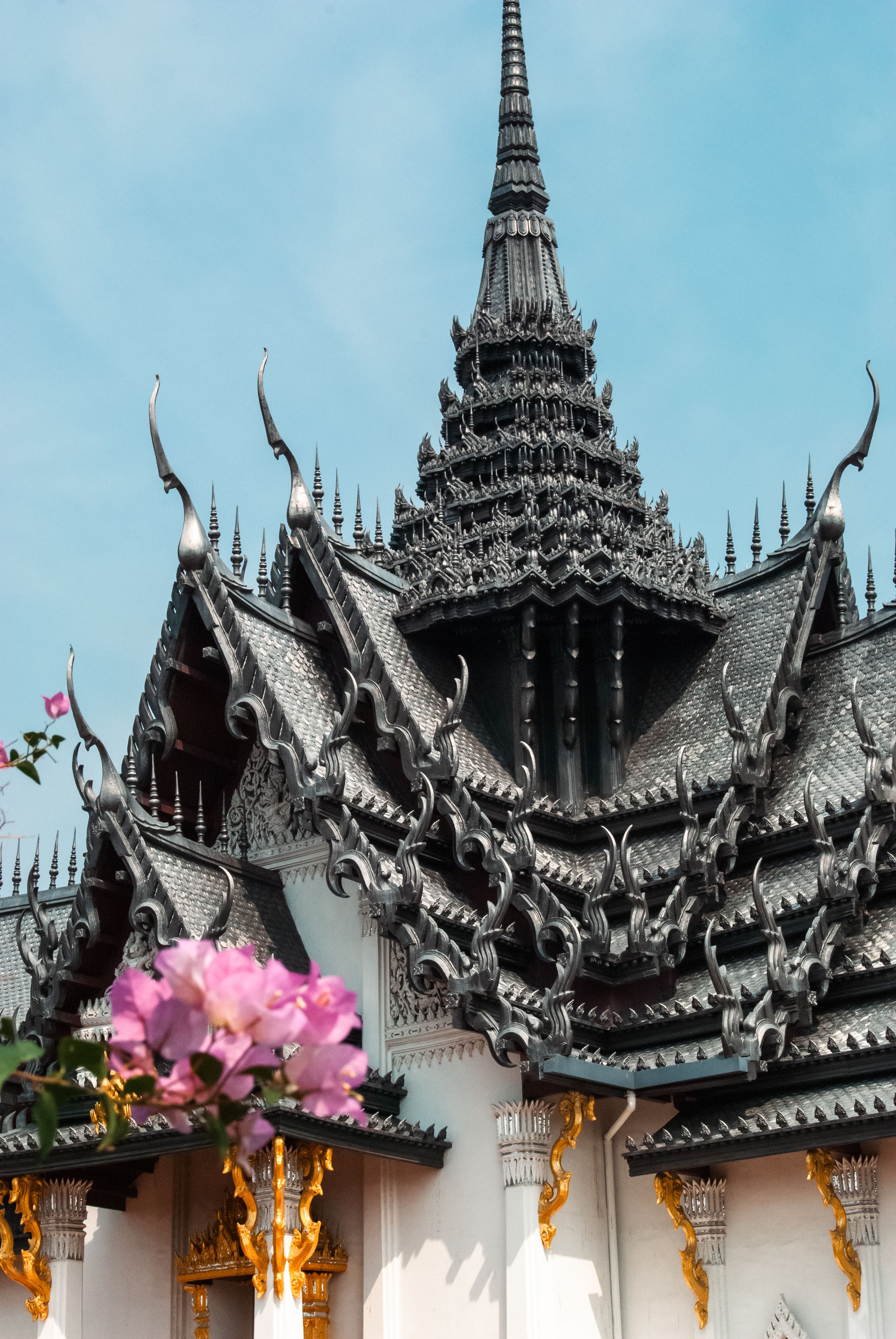 Exquisite Thai Temple Architecture with Blooming Flowers · Free Stock Photo