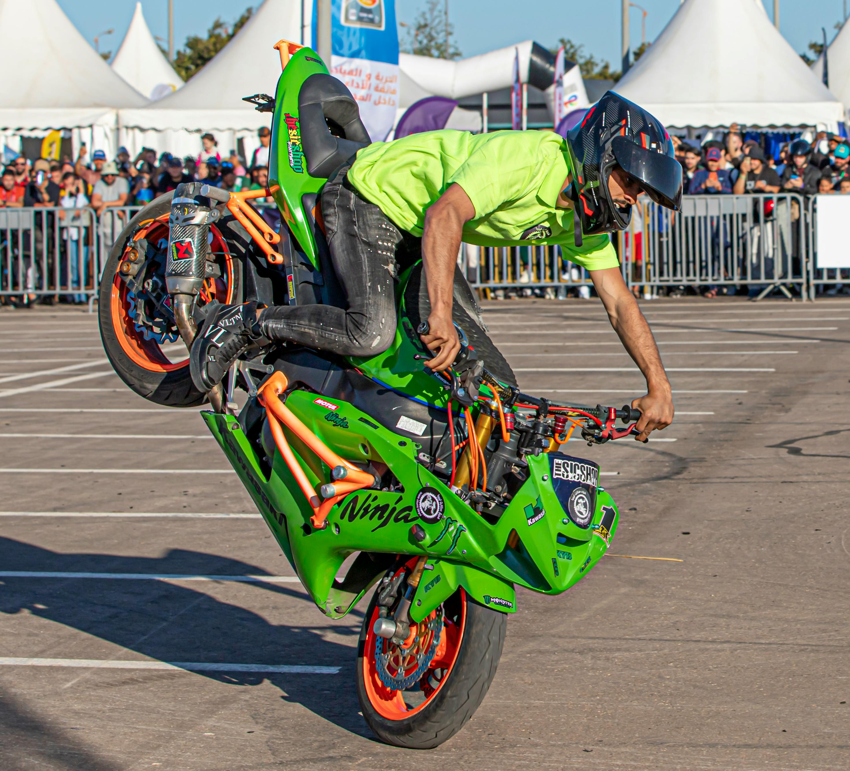 High-energy motorcycle stunt performance in Algeria · Free Stock Photo
