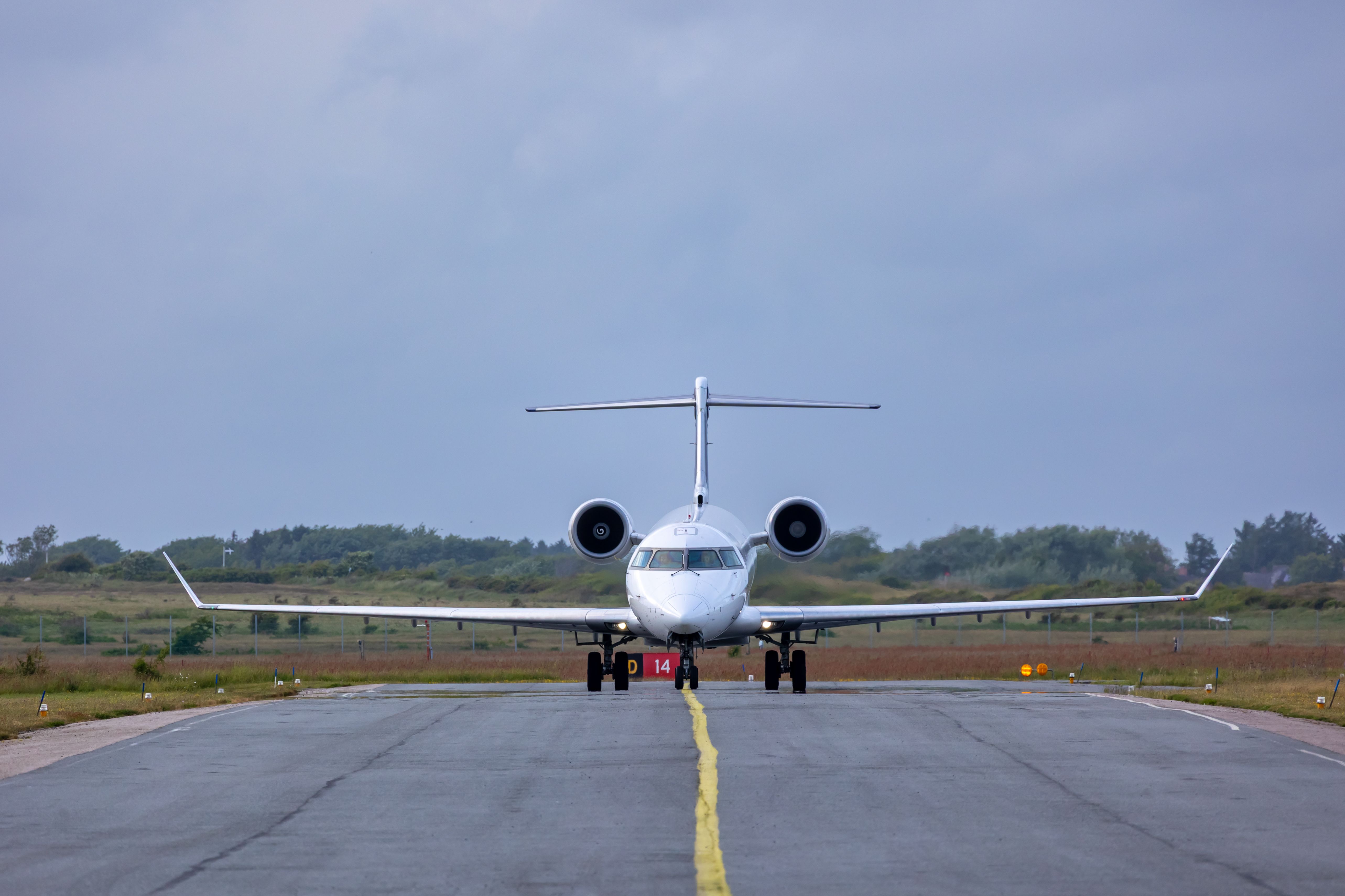 Front View of Airplane on Runway in Overcast Weather · Free Stock Photo