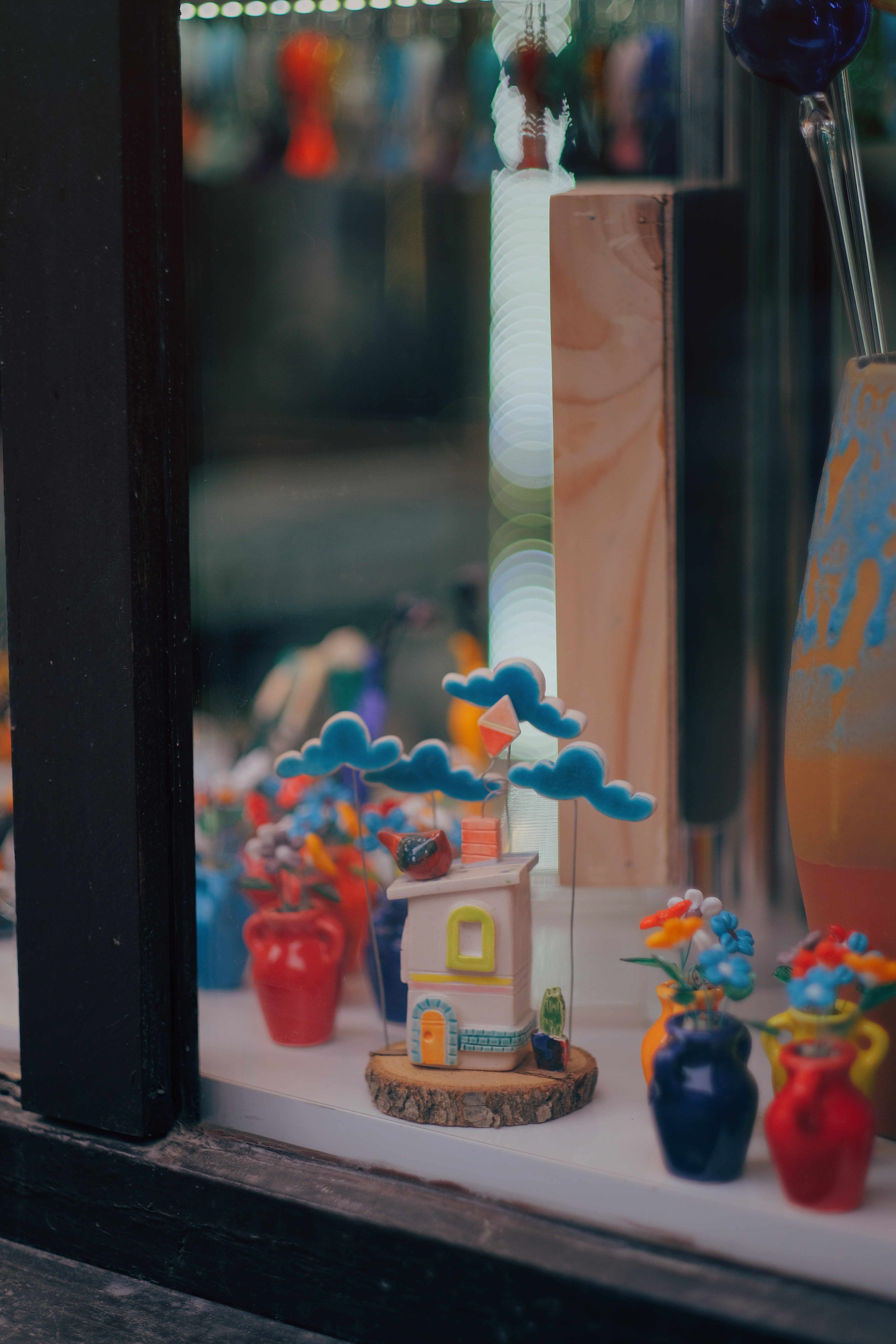 Colorful Miniature House Display in Storefront · Free Stock Photo