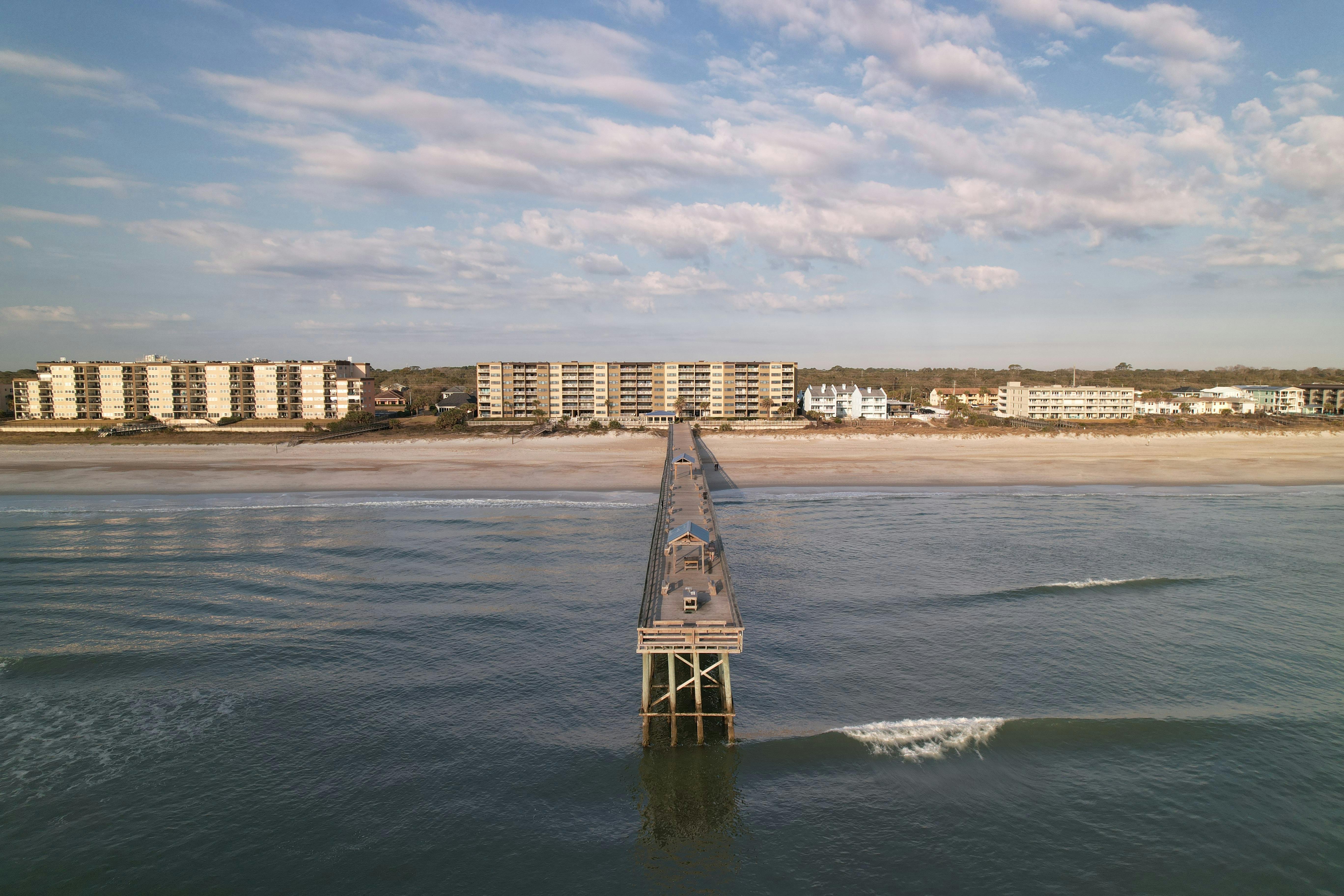 Scenic Aerial View of Ocean Pier and Beachfront Buildings · Free Stock ...