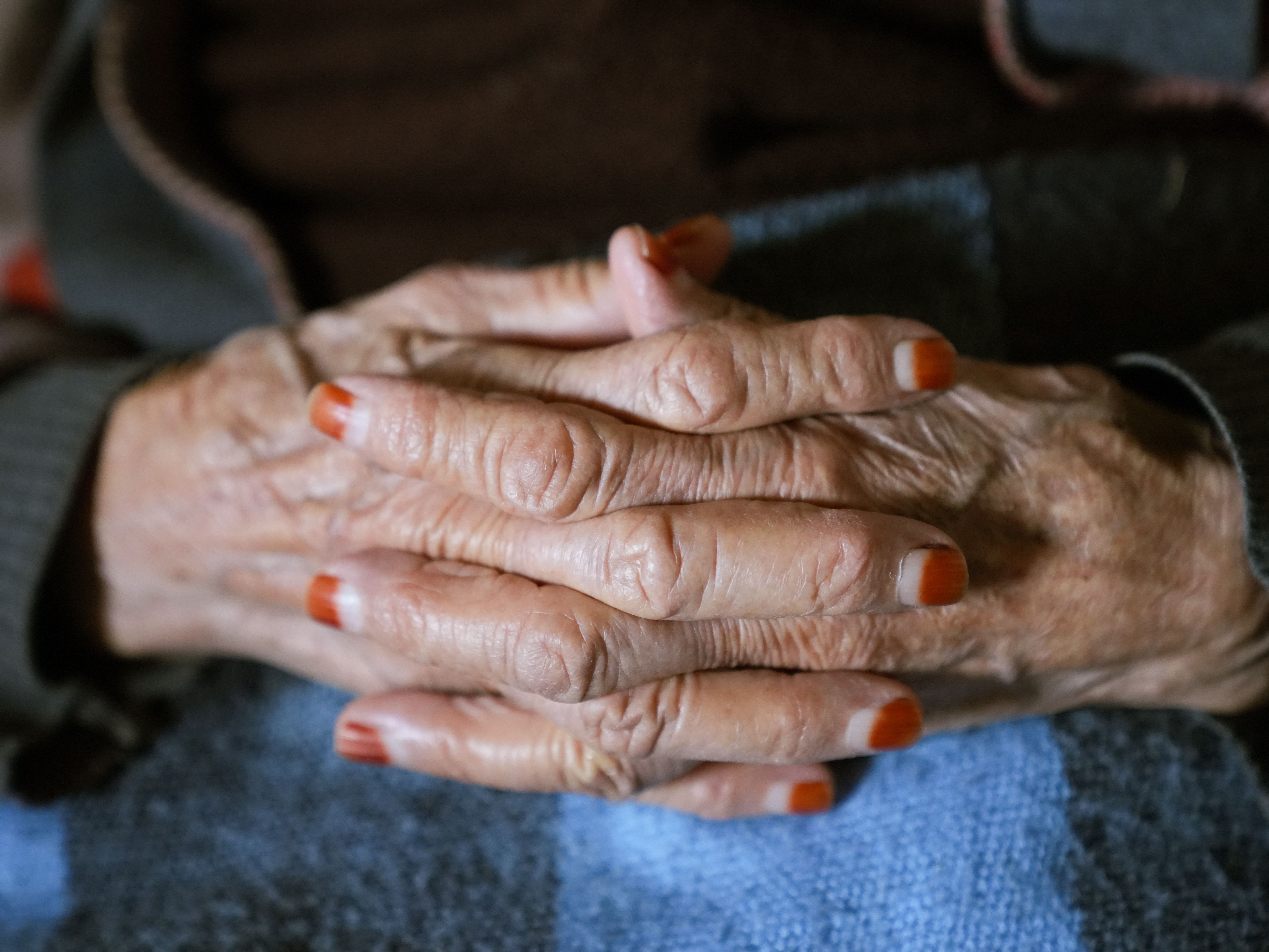 Close-Up of Elderly Hands with Painted Nails · Free Stock Photo