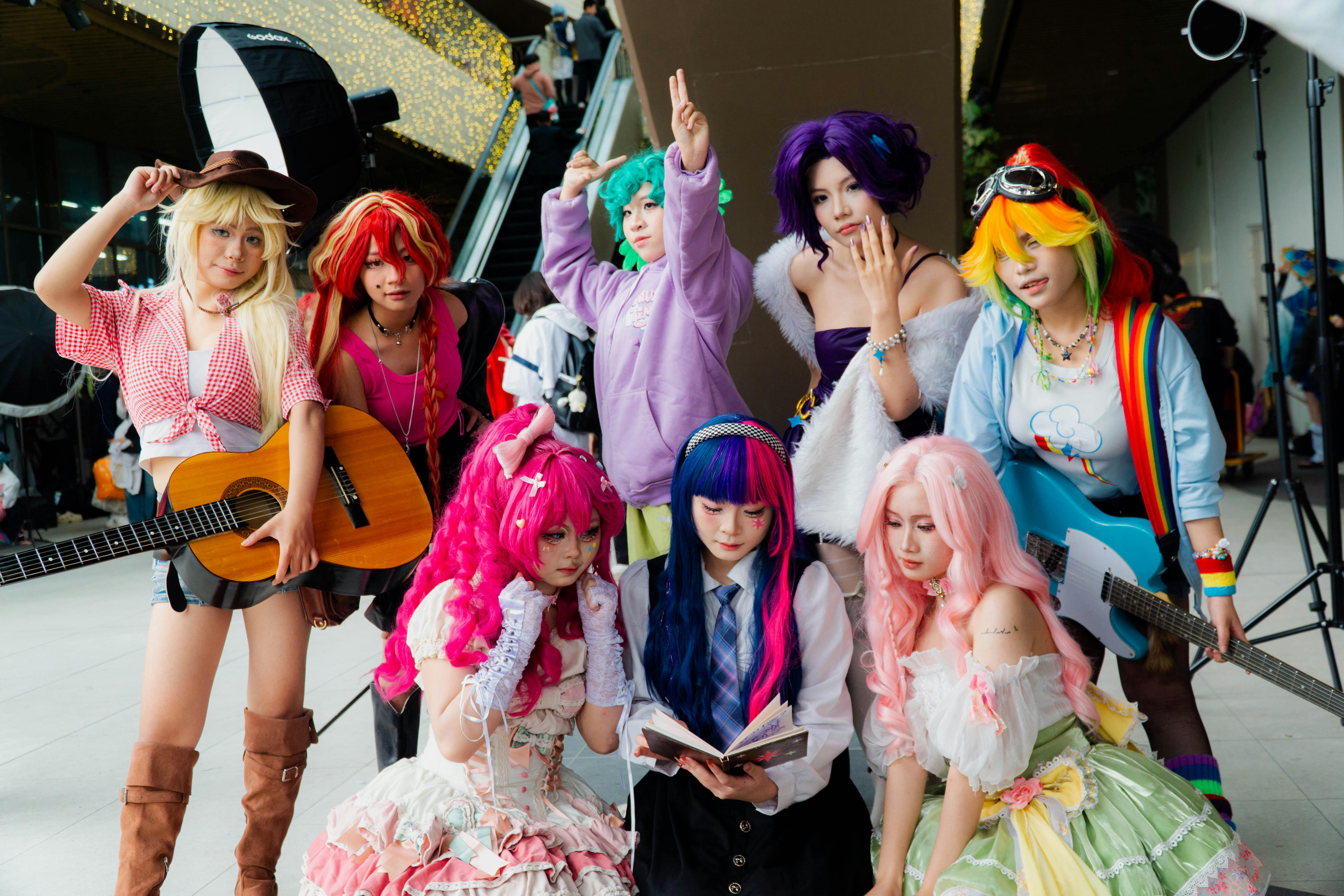 Colorful Anime Cosplay Group with Instruments · Free Stock Photo