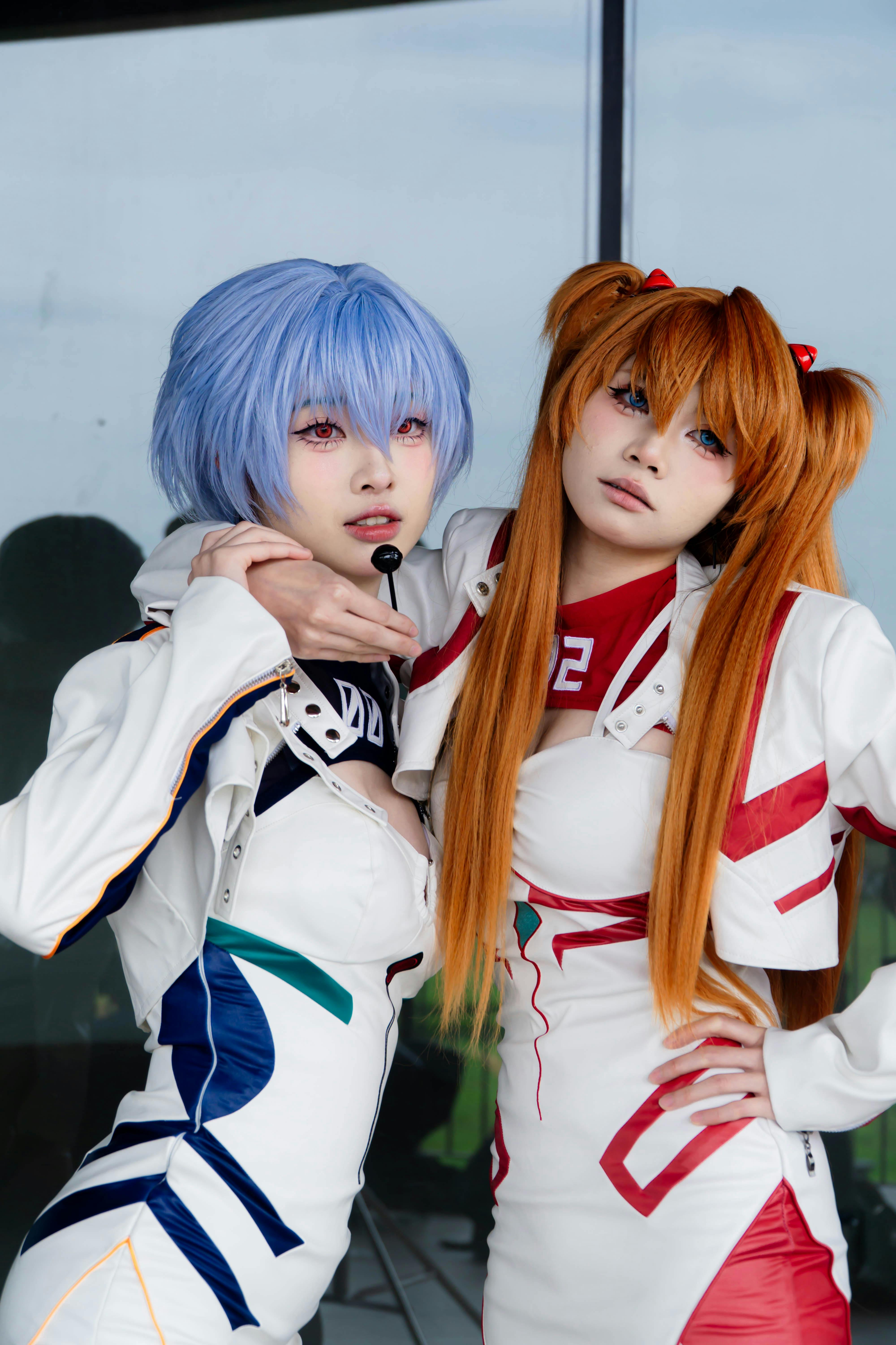 Dynamic Cosplay Duo in Anime Costumes · Free Stock Photo