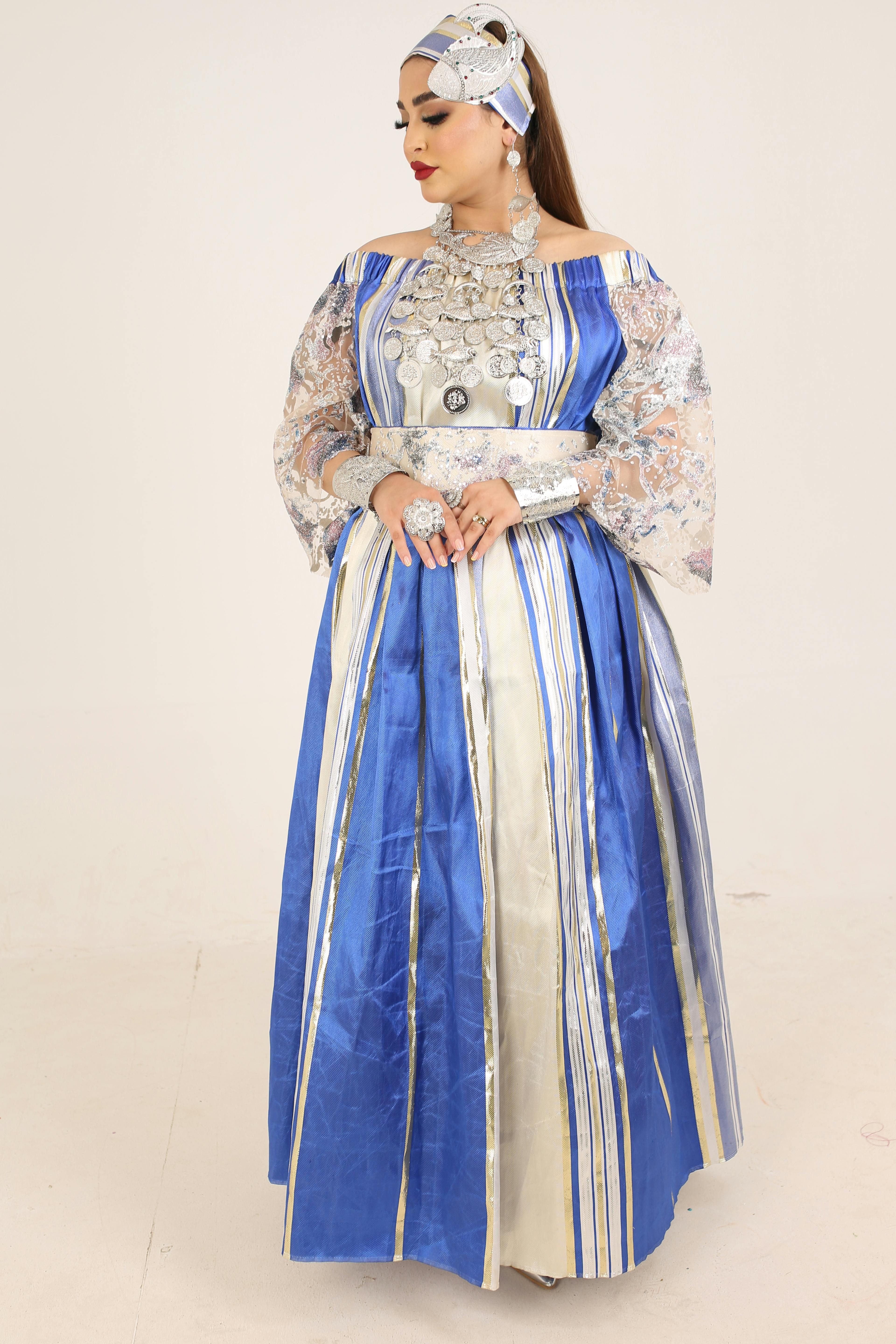 Libyan Traditional Dress in Elegant Blue and Silver · Free Stock Photo