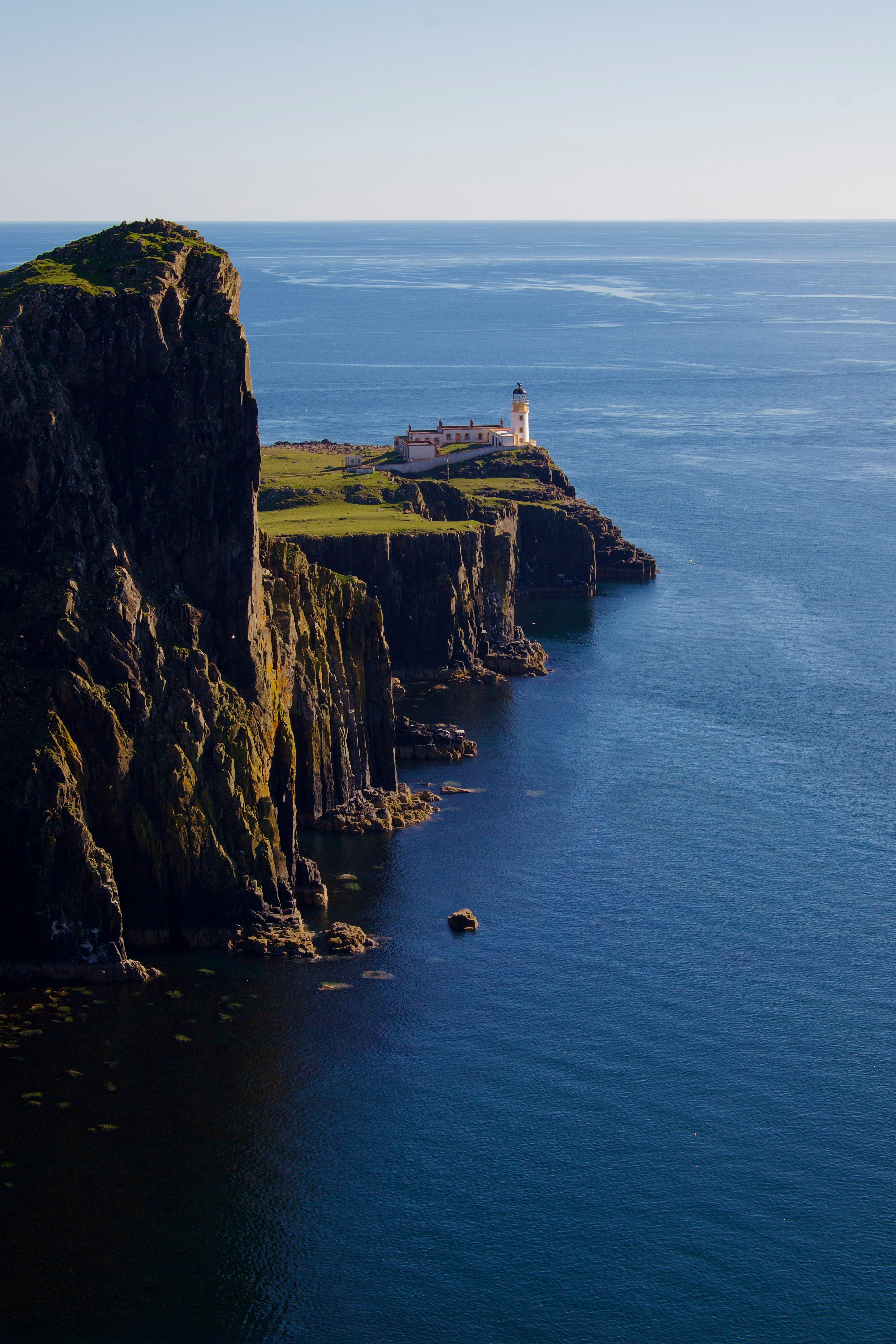Iconic Neist Point Lighthouse on Scottish Cliffside · Free Stock Photo